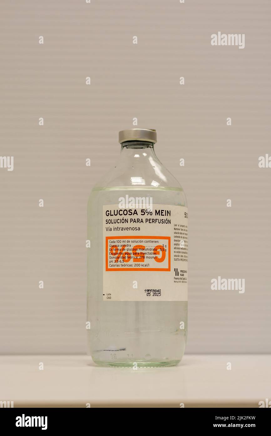 Photography of a Glass bottle with 500 ml of 5% dextrose serum for ...