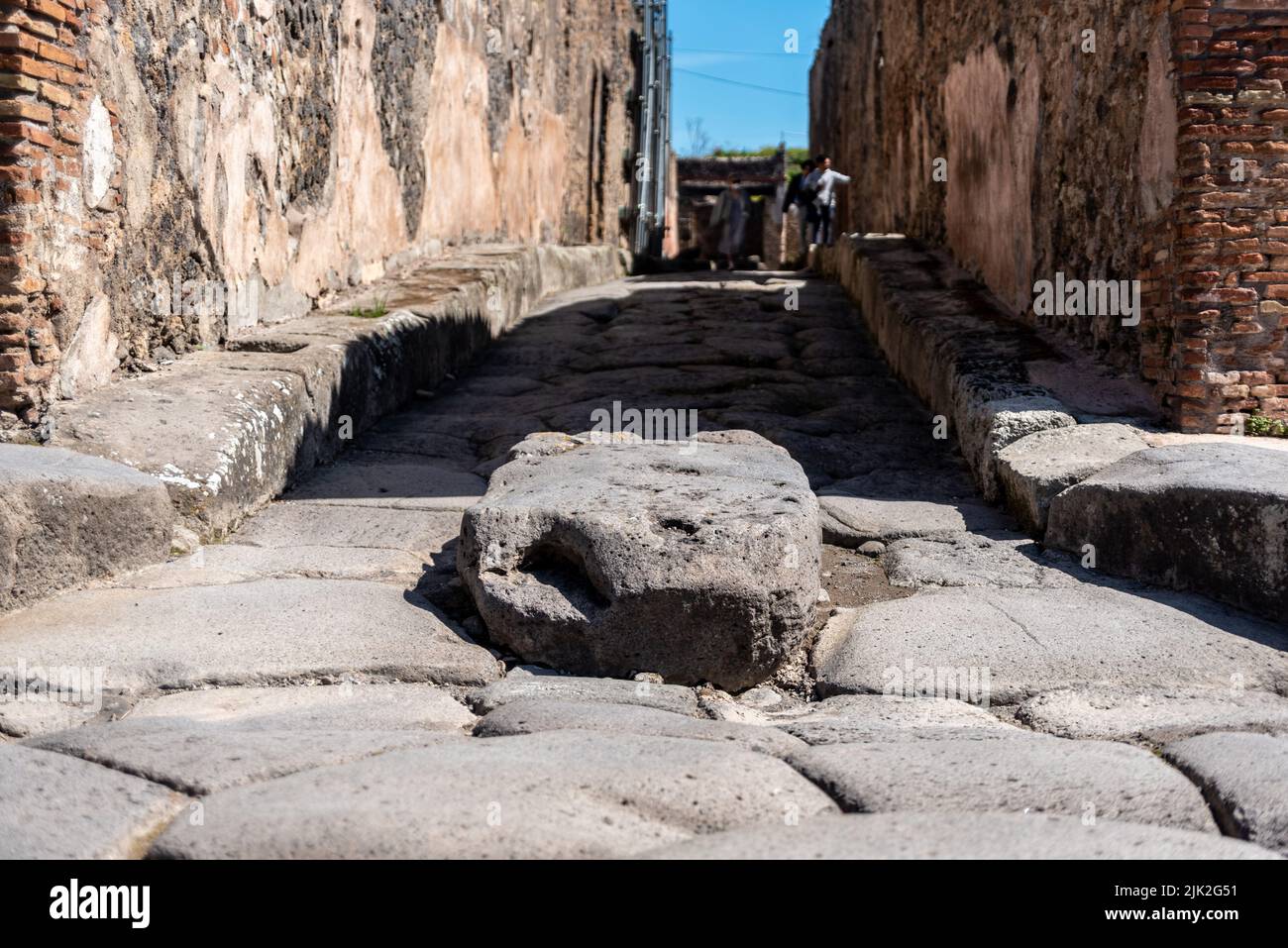 A crosswalk of a typical Roman road in the ancient city of Pompeii ...