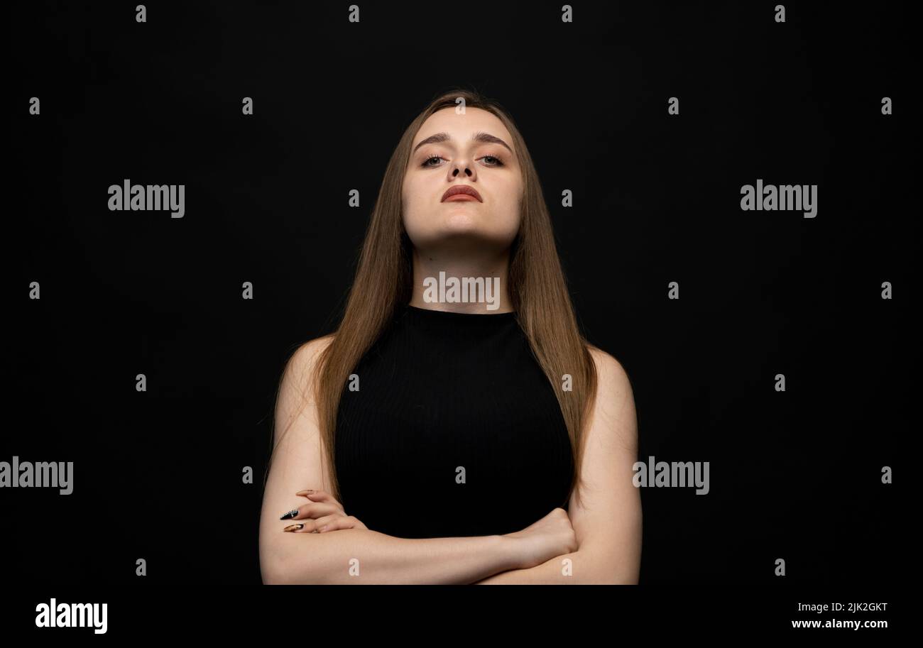 Negative human emotions and feelings. Grumpy young woman posing ... Negative human emotions and feelings. Grumpy young woman posing ...