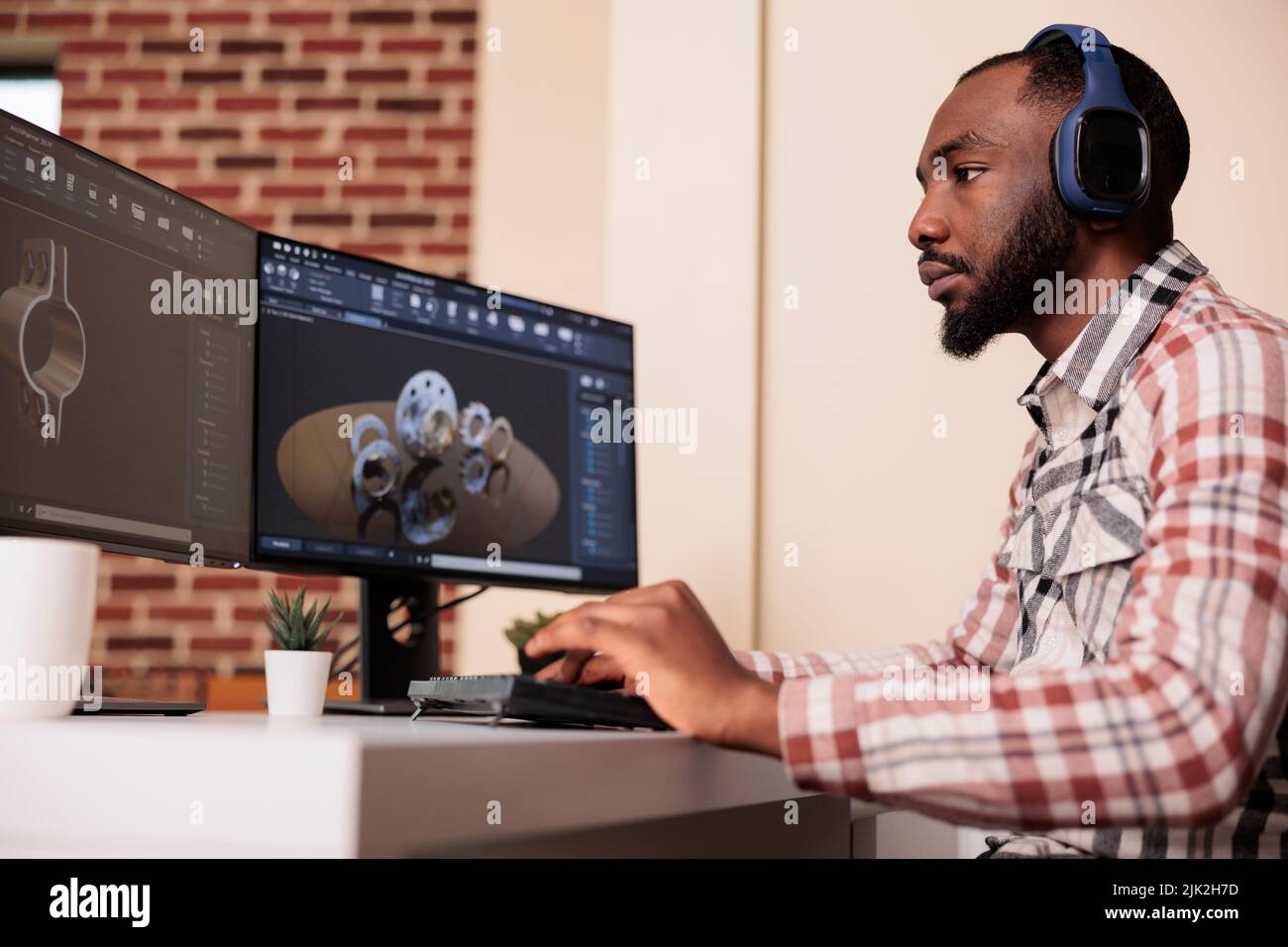 African american engineer prototyping gears model on manufacturing ...