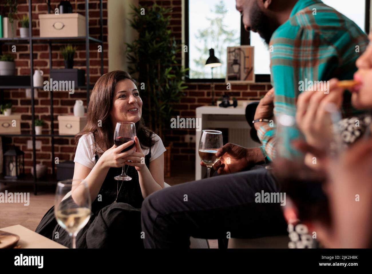 Friendly diverse people celebrating birthday while enjoying drinking ...