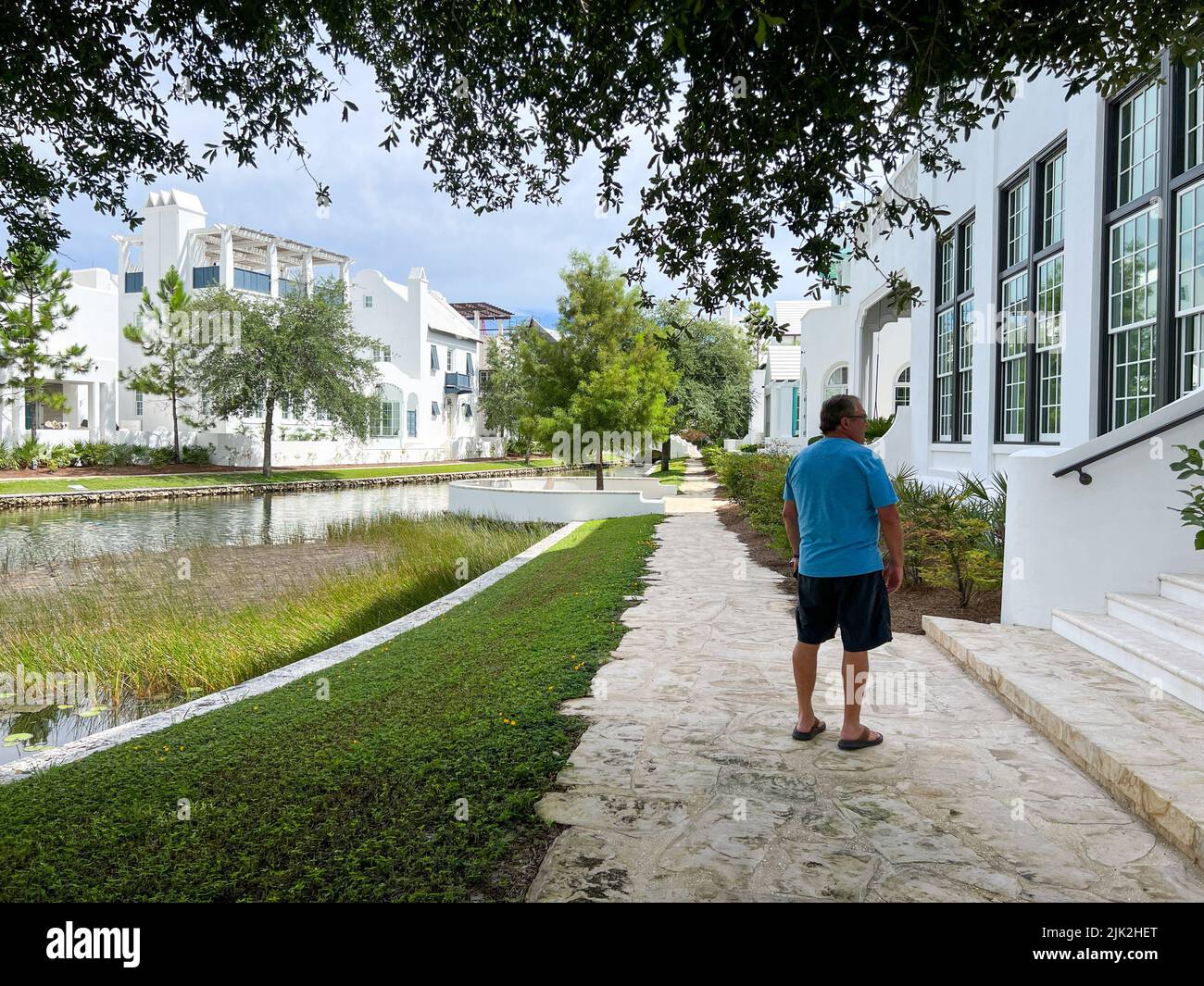 Alys Beach, FL USA - July 26, 2022: A walking path with water feature ...