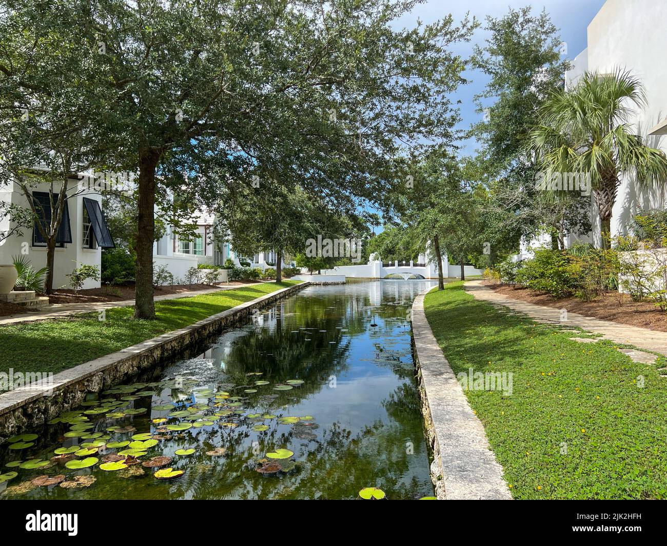 Alys Beach, FL USA - July 26, 2022: A walking path with water feature ...