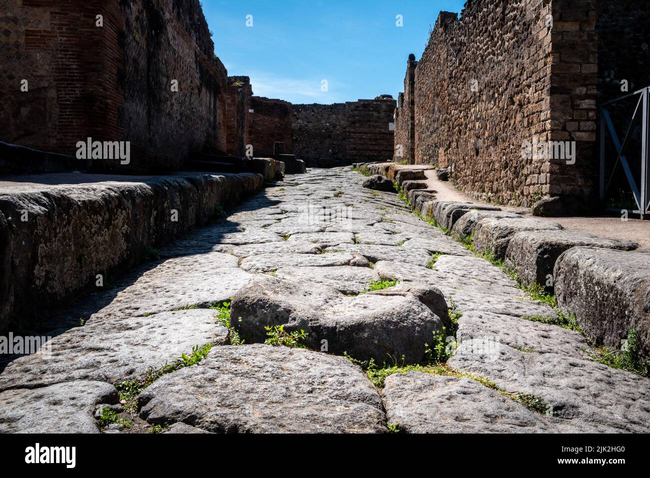A crosswalk of a typical Roman road in the ancient city of Pompeii ...
