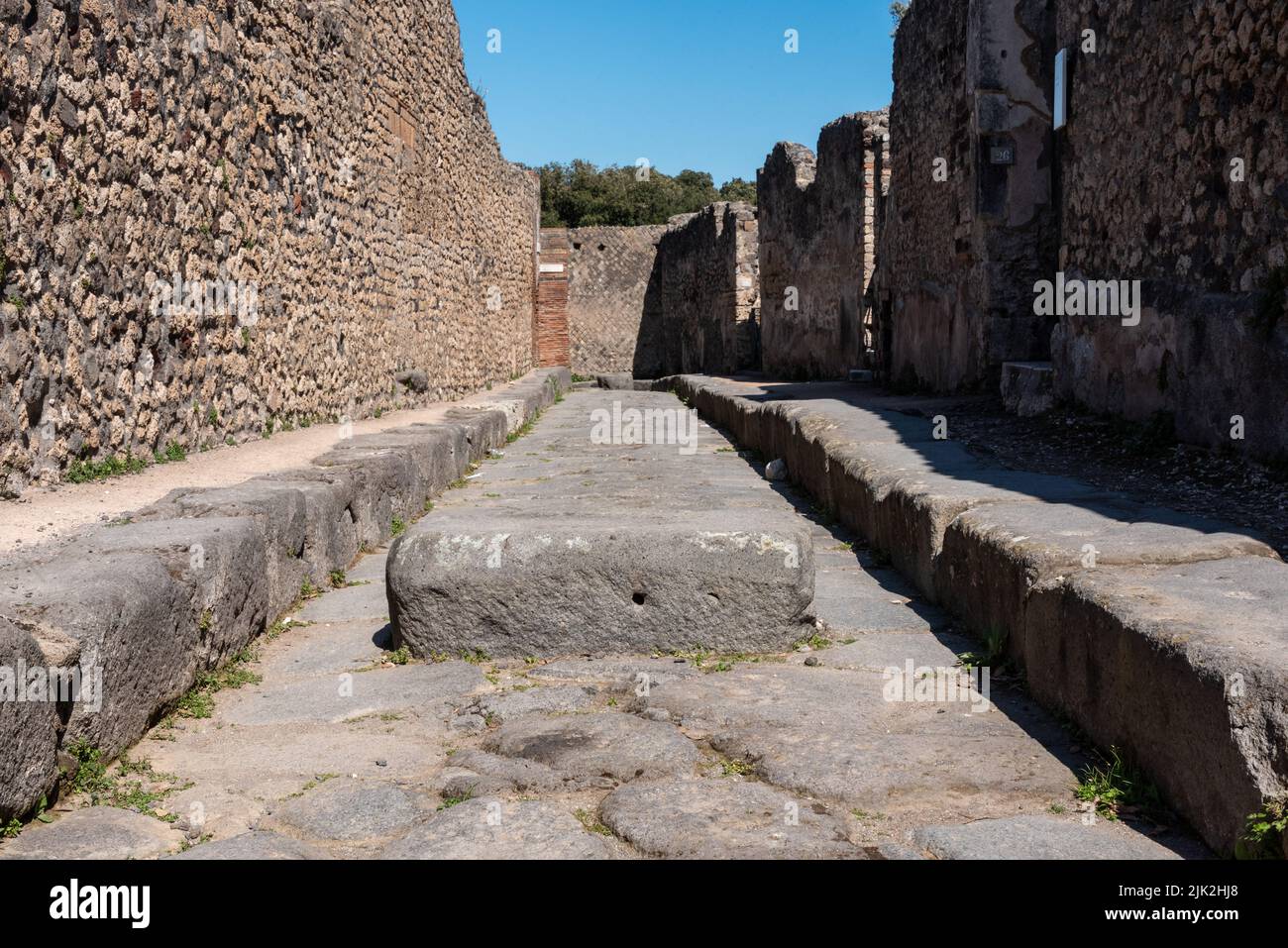 A crosswalk of a typical Roman road in the ancient city of Pompeii ...