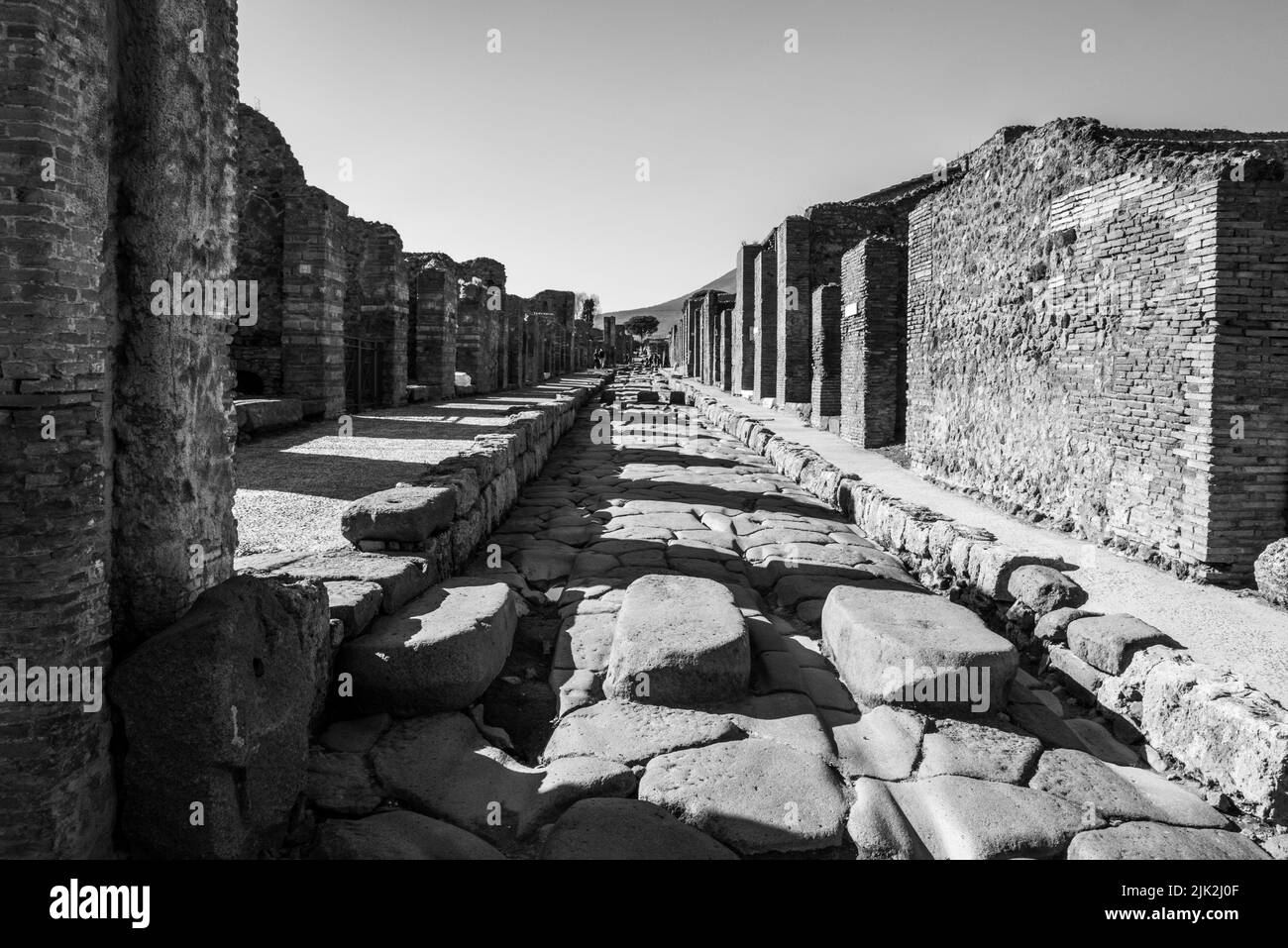 A crosswalk of a typical Roman road in the ancient city of Pompeii ...