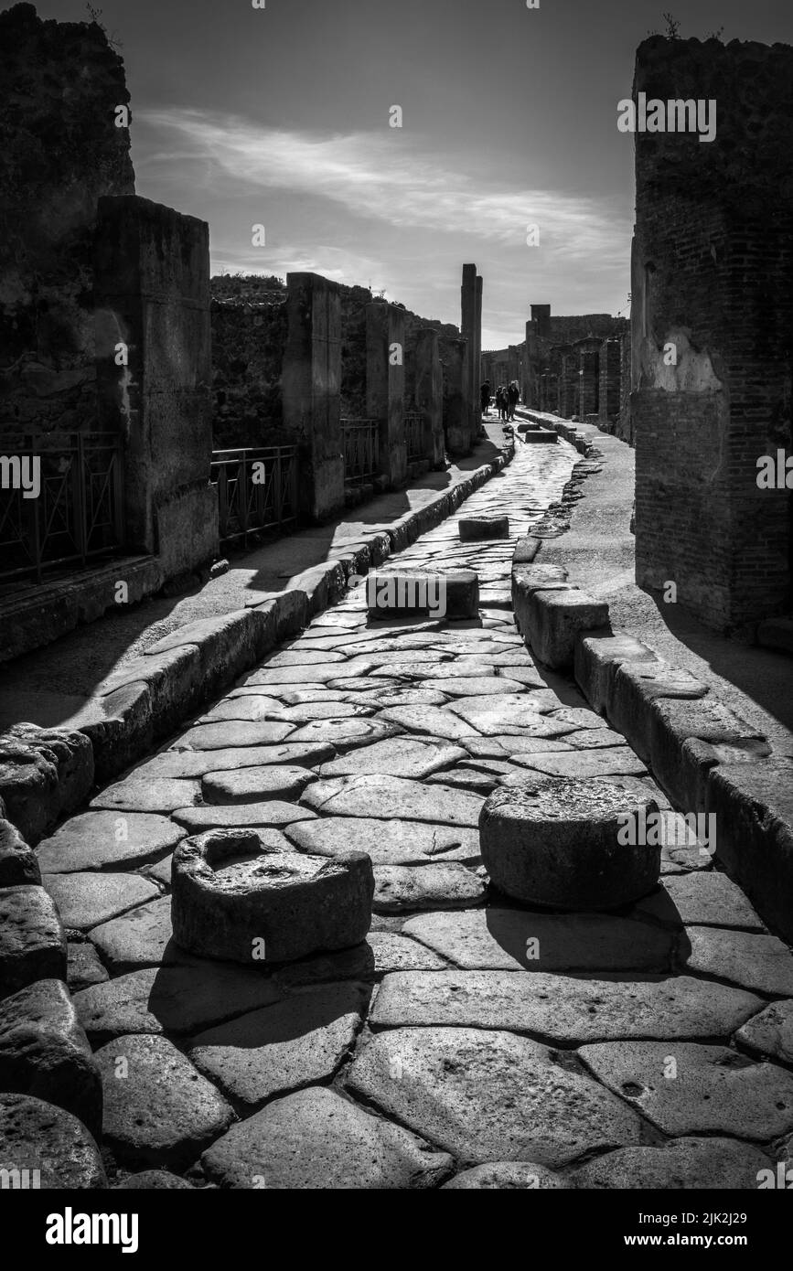 A crosswalk of a typical Roman road in the ancient city of Pompeii ...