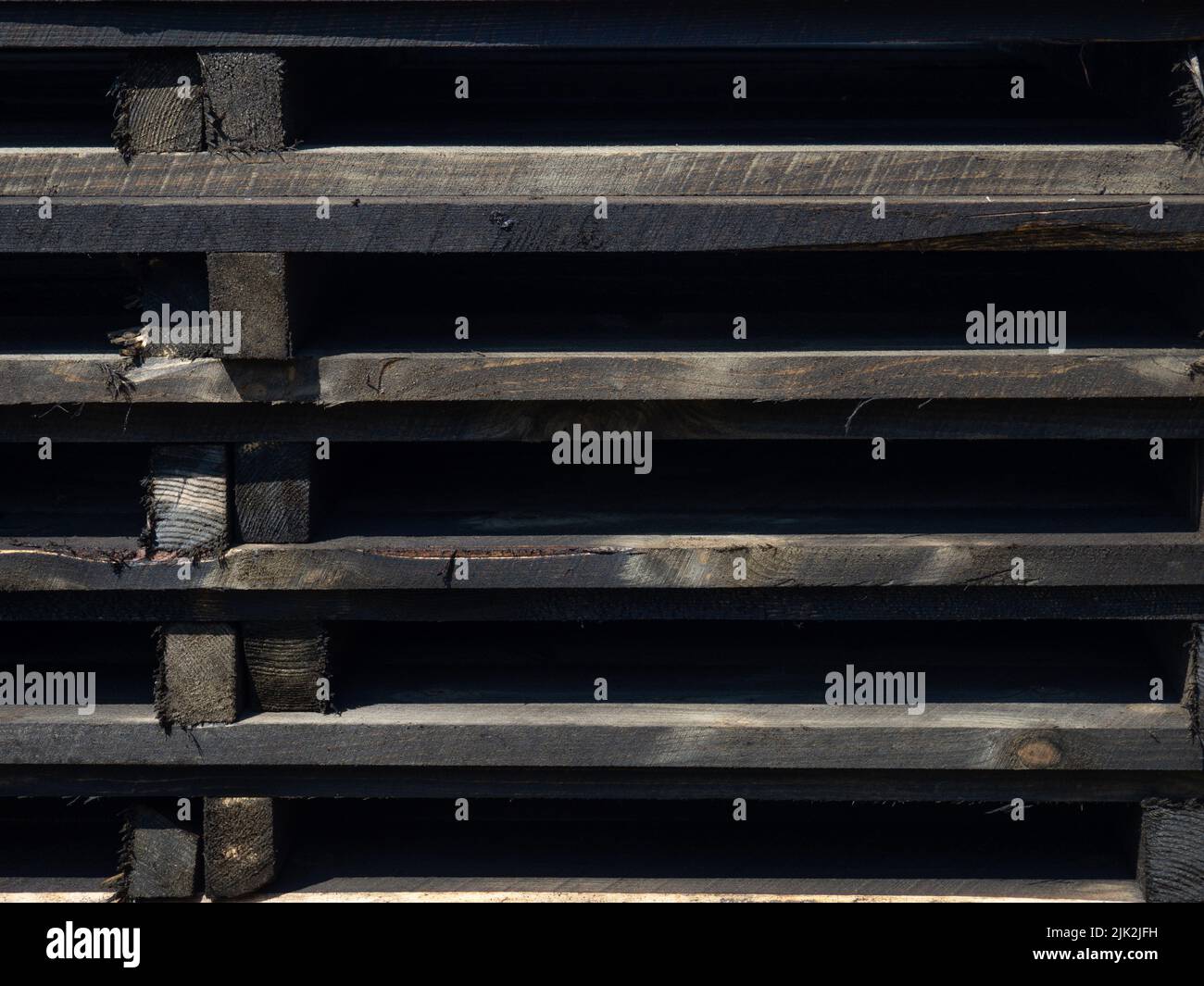 Many pallets painted in black. Lots of broken boards. Industrial Zone ...