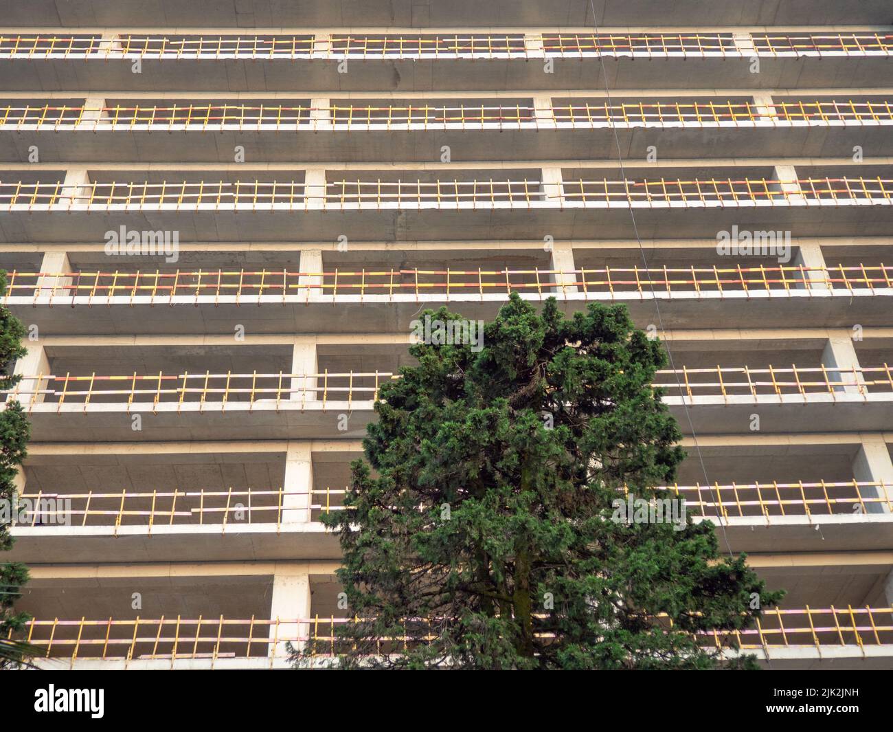Standing building from the bottom up. Lift at a construction site ...