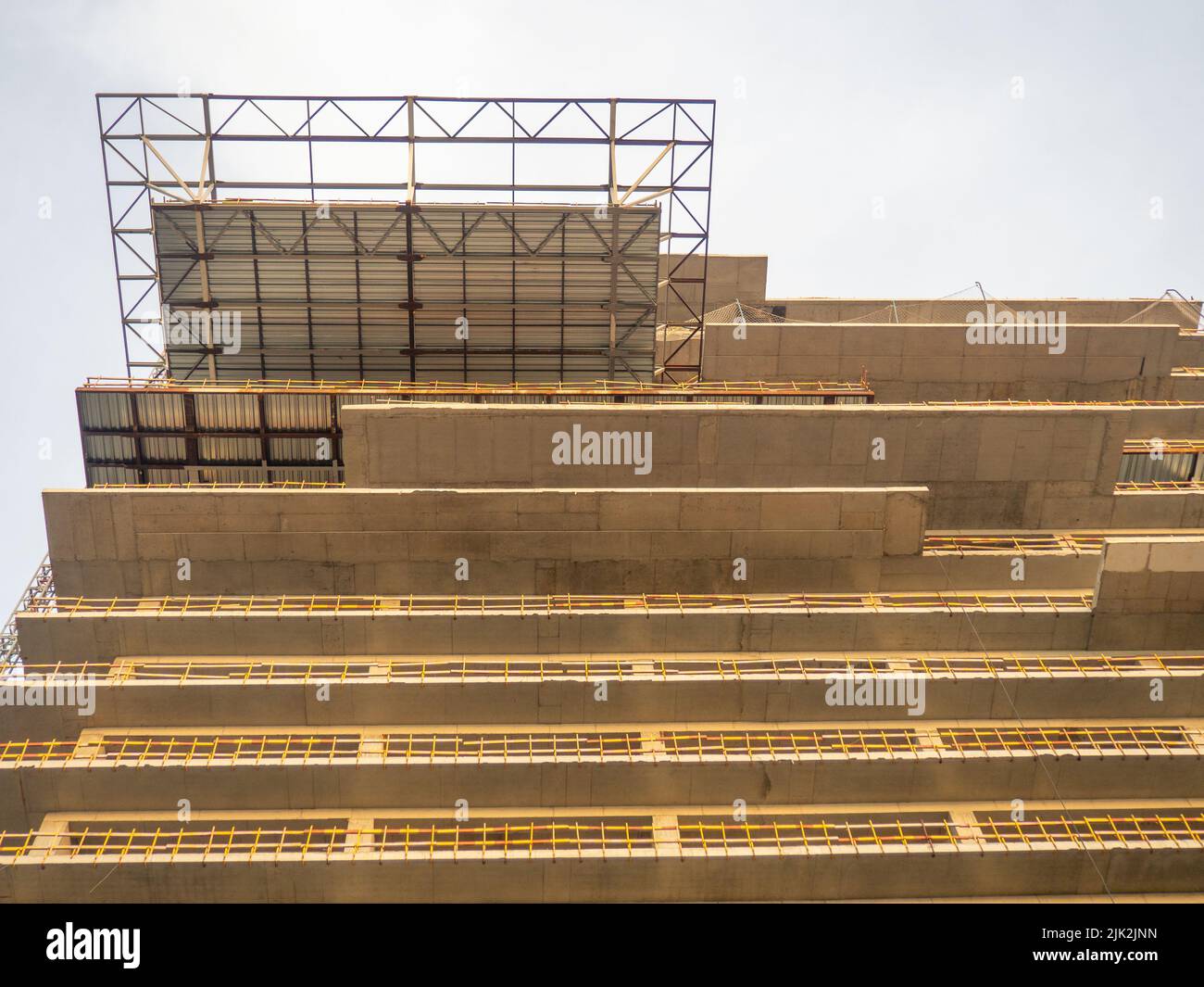Standing building from the bottom up. Lift at a construction site ...