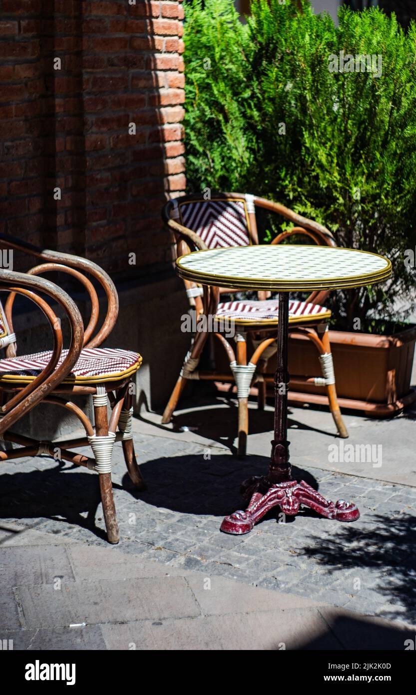 Outdoor cafe with tiny table and chairs in the oldest part of Tbilisi ...