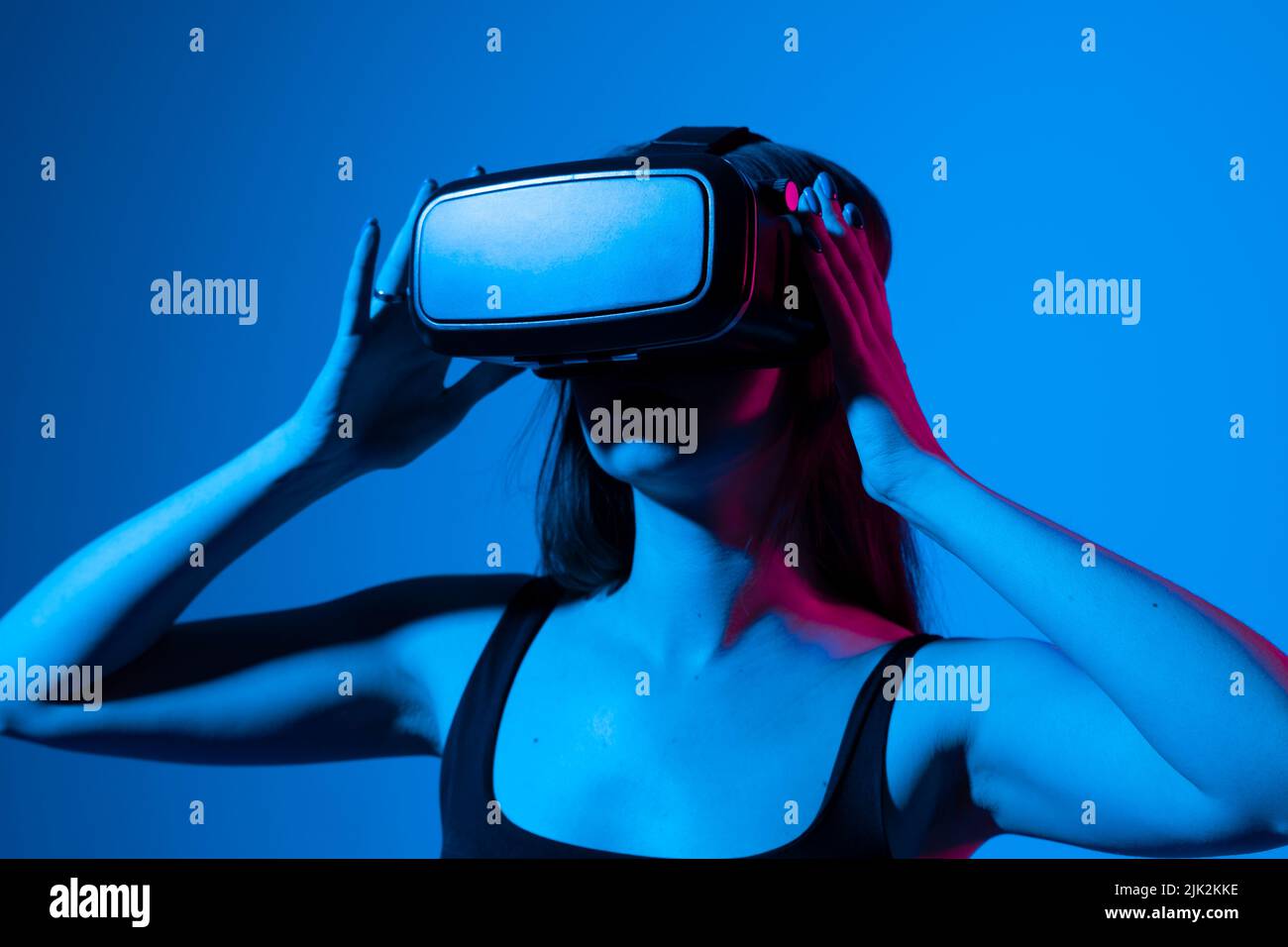 Woman Enjoying A Vr Experience Woman With Vr Headset Touching Invisible Screen Future