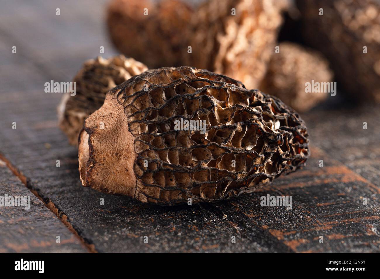 Morel Mushrooms on a Dark Wooden Table Stock Photo - Alamy