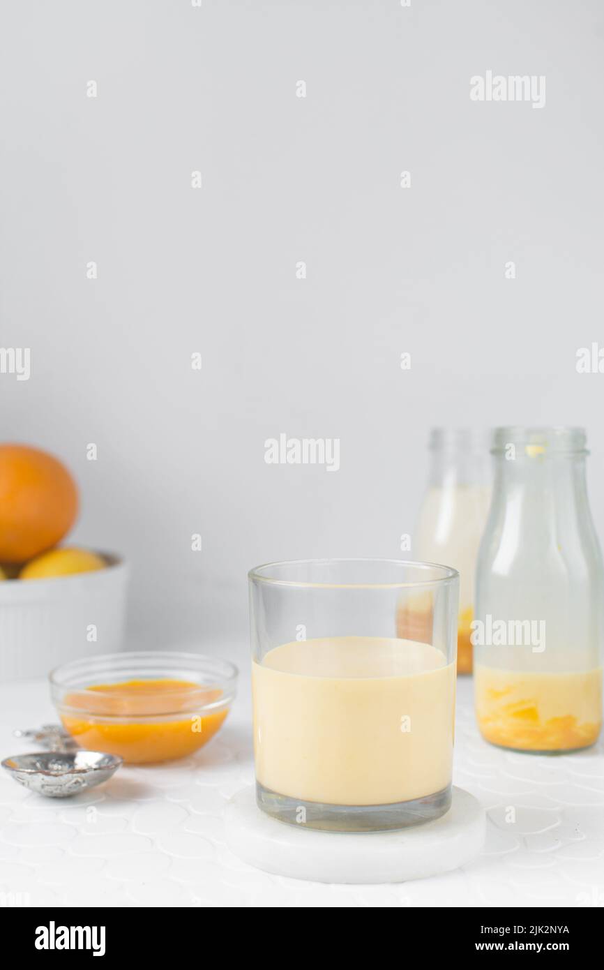 Mango milk in a classic glass milk bottle, mango puree and whole milk ...