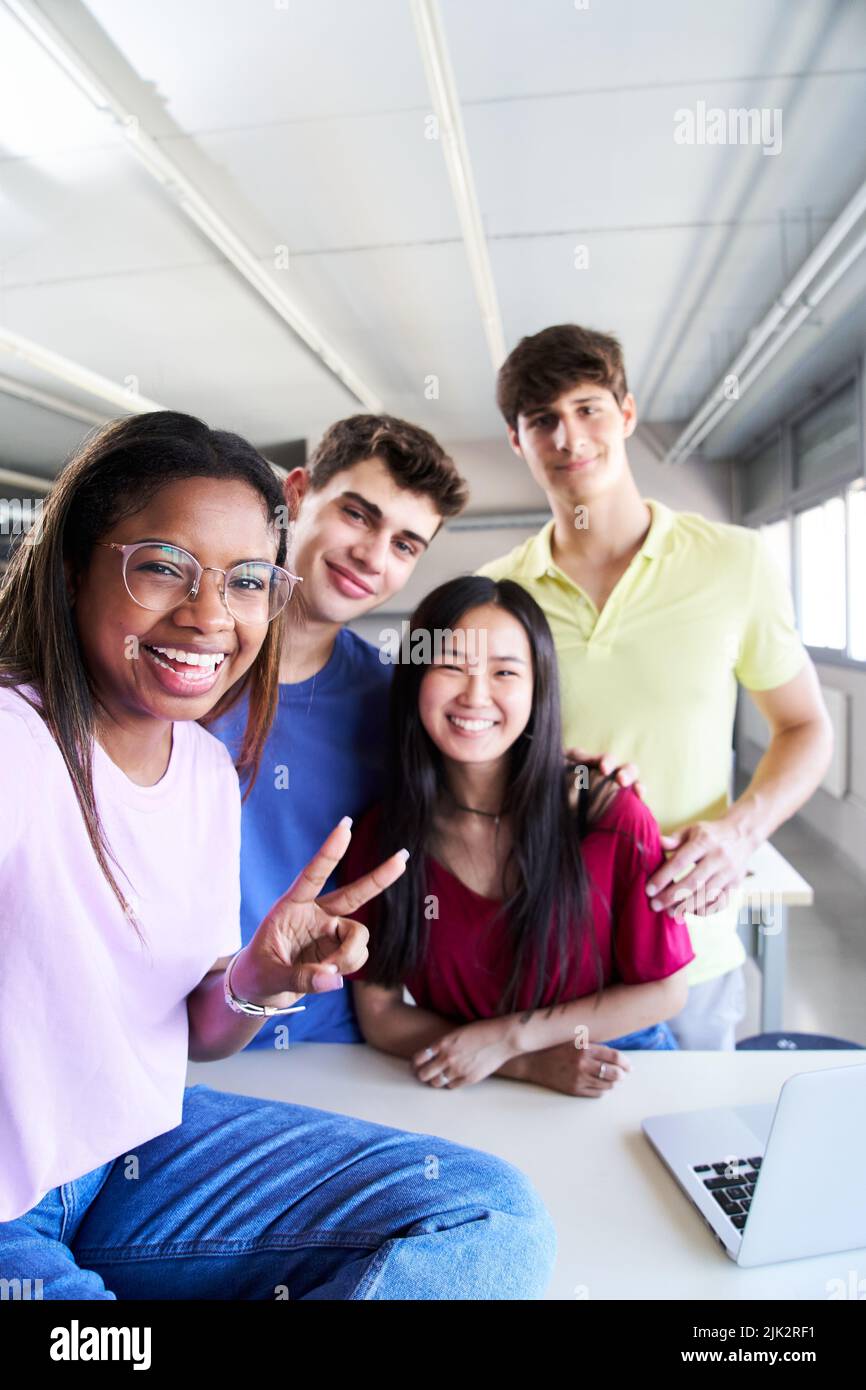 Vertical Selfie Portrait of a group of students in class looking at the ...