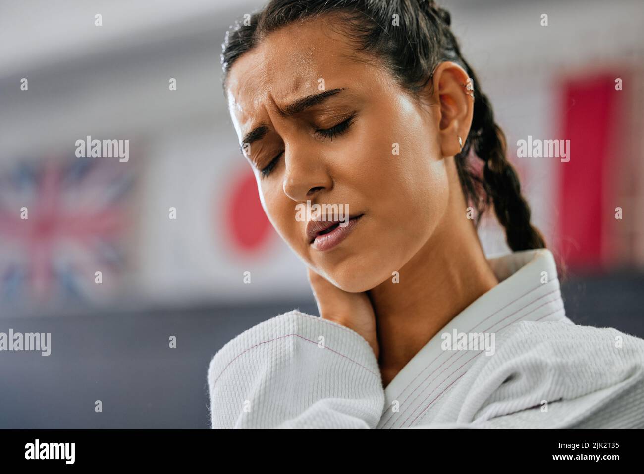 Young active female with pain from training in a karate and fitness ...