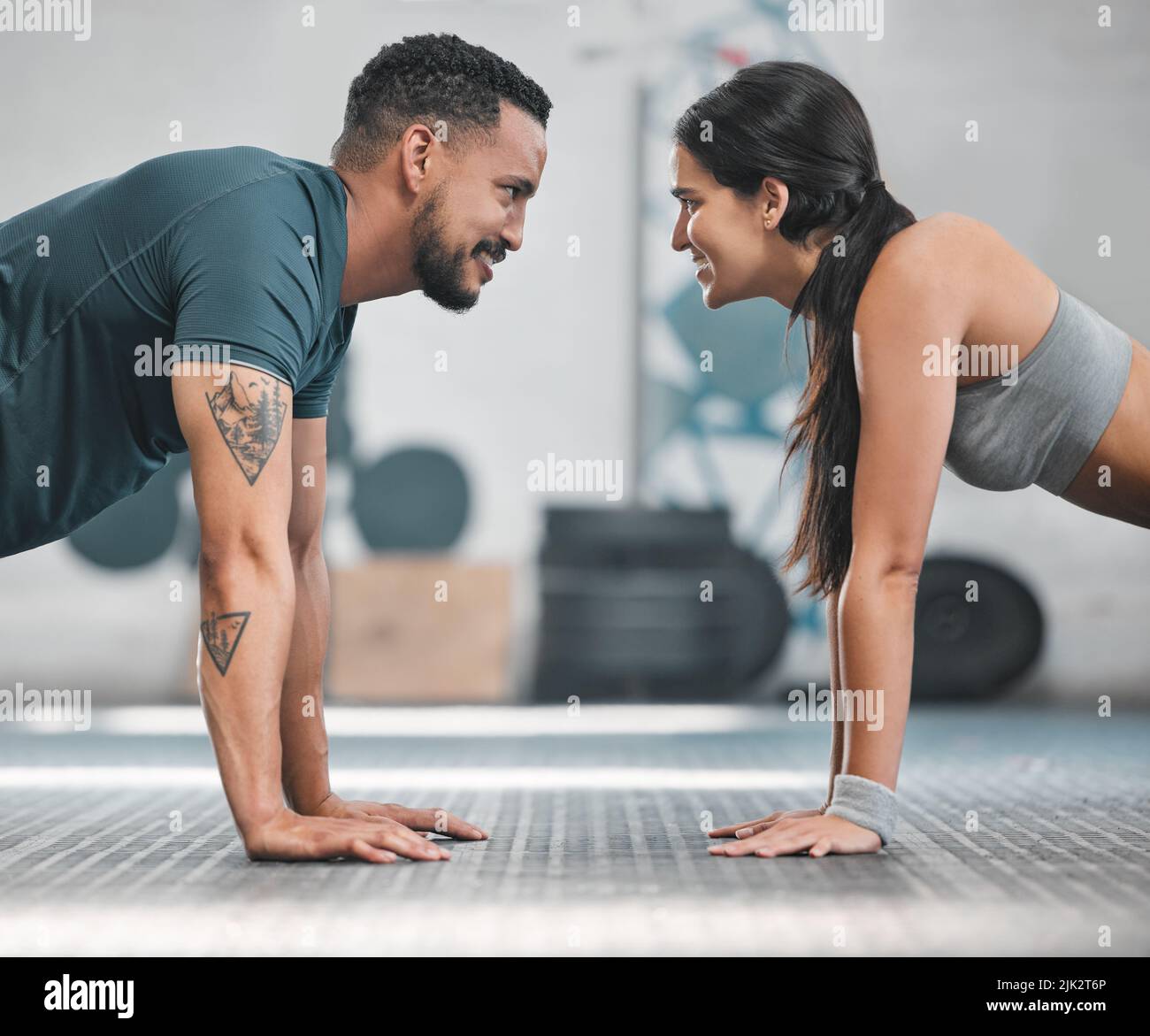 Fitness, health and active couple training together in a gym doing ...