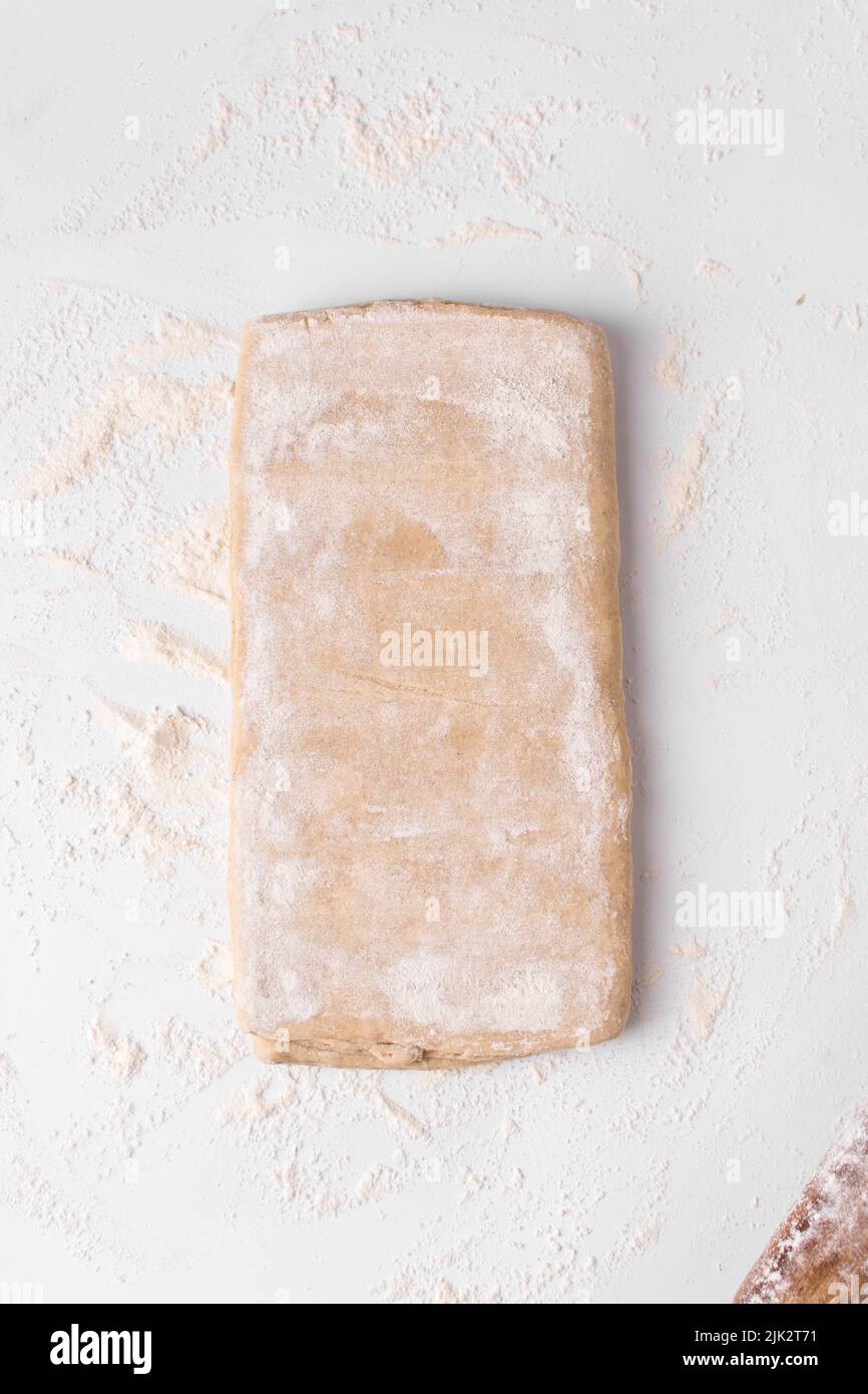 Pastry dough rolled out on a white background, stretched dough Stock ...