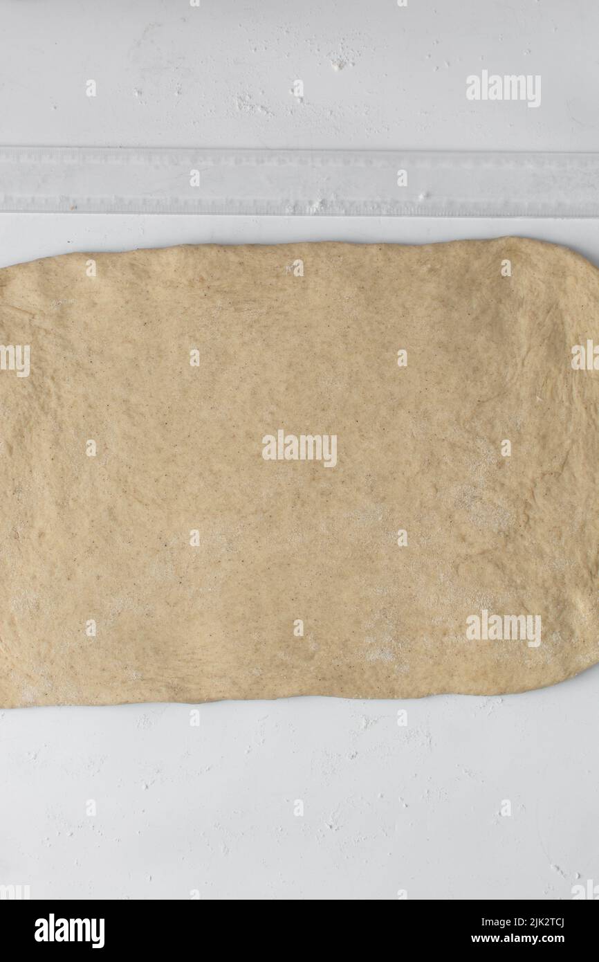 Pastry dough rolled out on a white background, stretched dough Stock ...