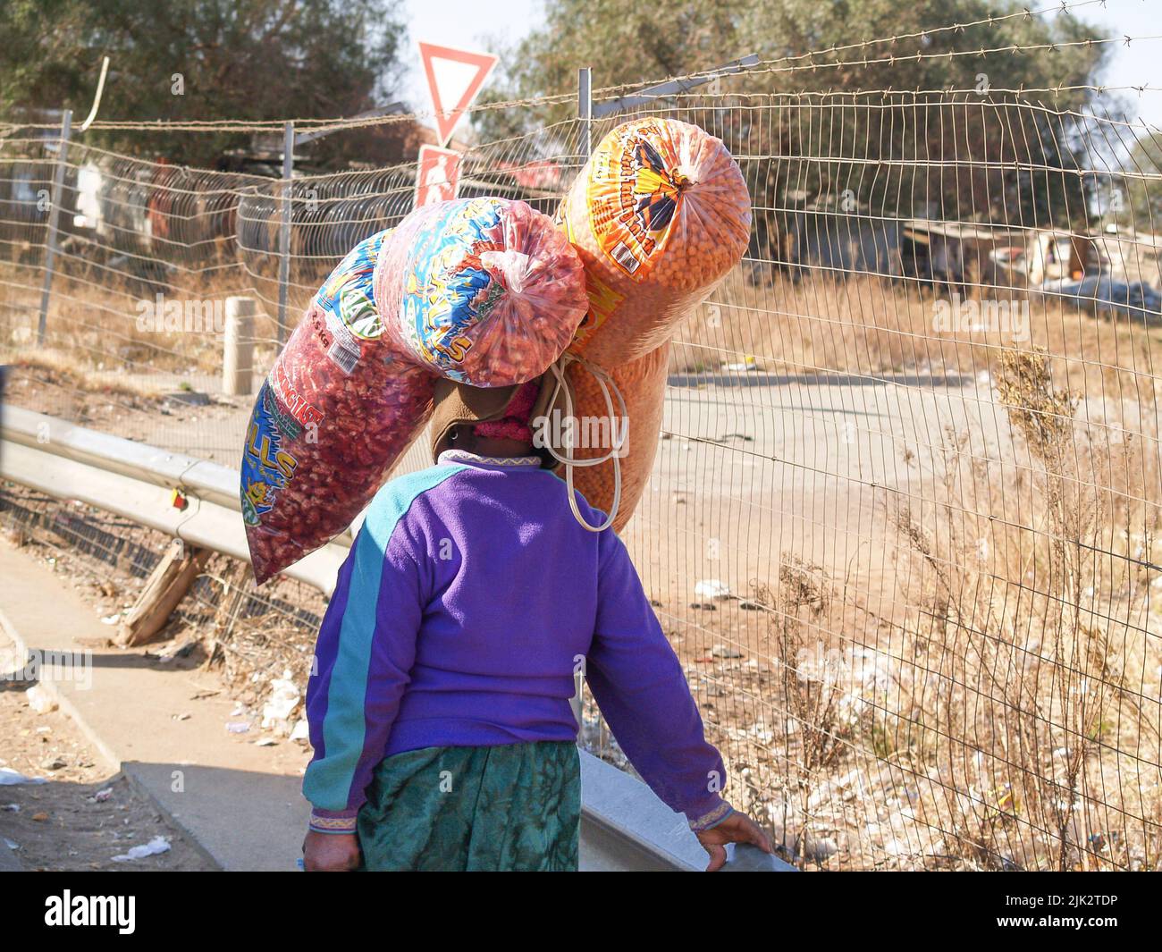 Woman plastic bags south africa hi-res stock photography and images - Alamy