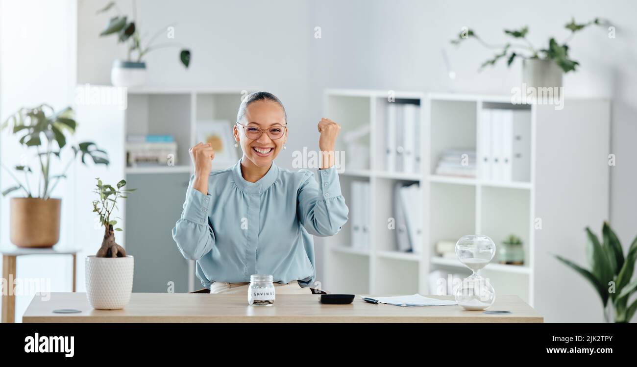 Celebrating, happy and smiling accountant looking cheerful, joyful and ...