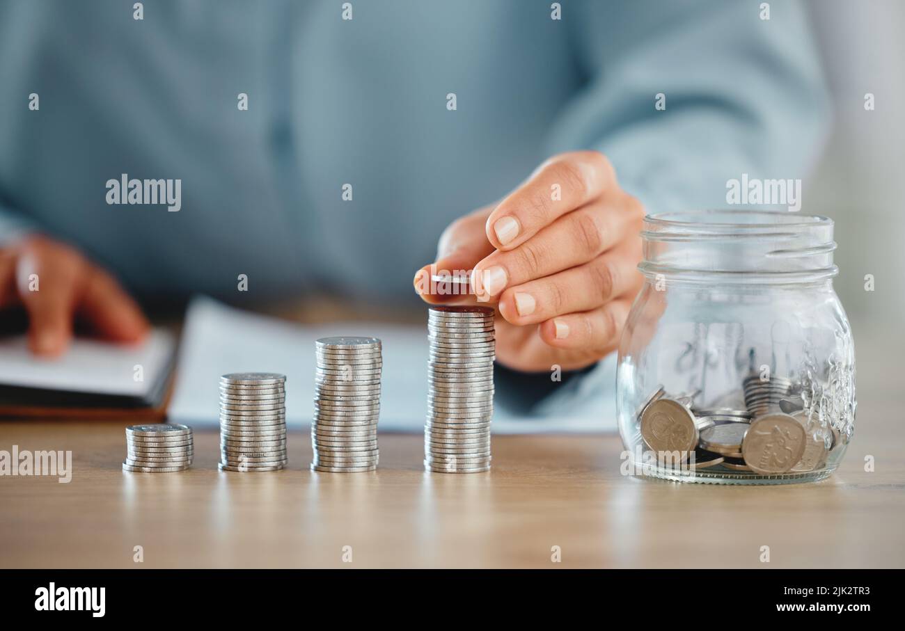 Hand holding coin stack hi-res stock photography and images - Alamy