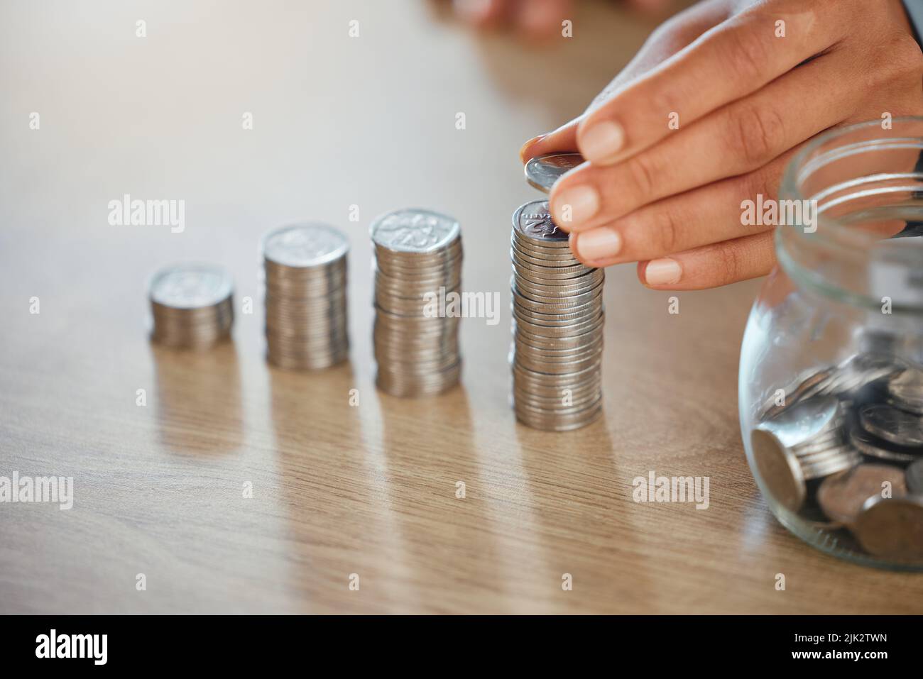 Coins for investment, profit and finance growth and savings on a table ...