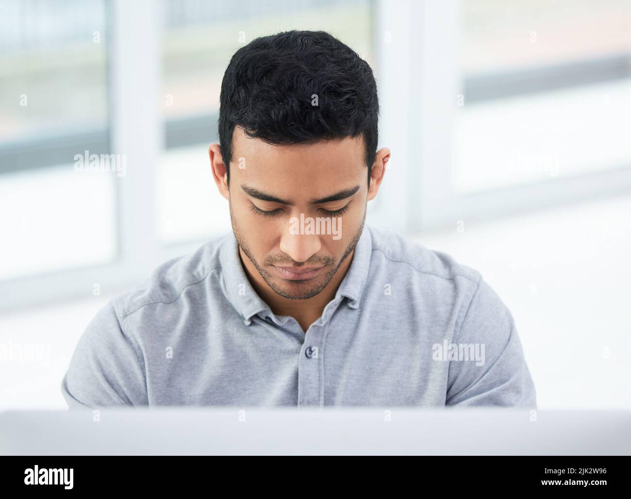 I have so much work to get done. a young businessman working at his ...