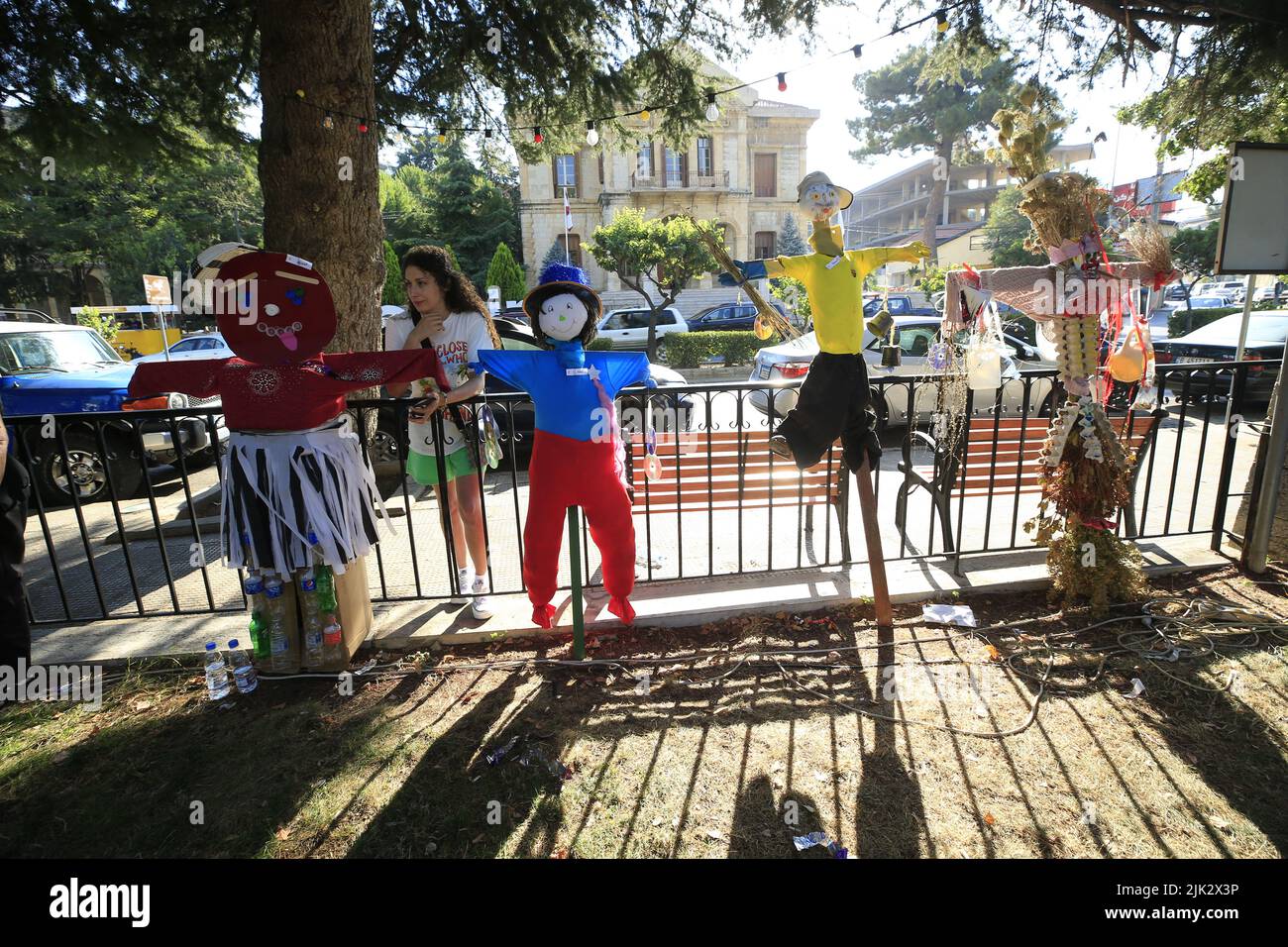 Beirut, Lebanon. 29th July, 2022. A woman observes scarecrows during a ...