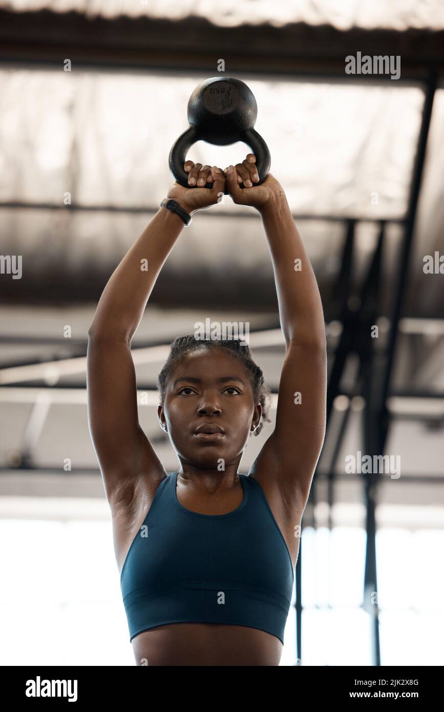 Lifting her standards. Low angle shot of an attractive and athletic ...