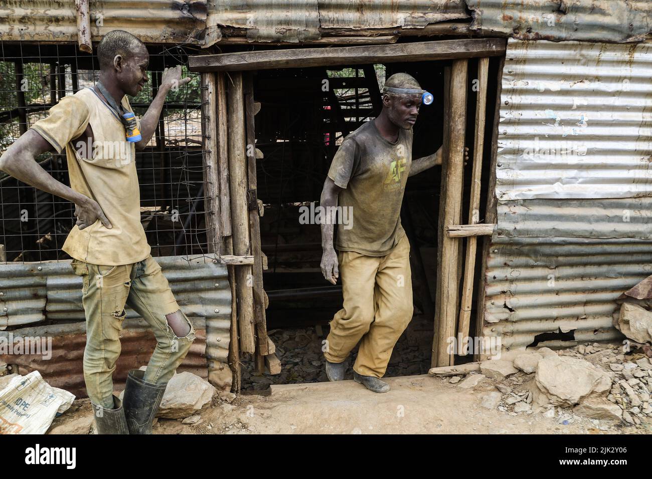 July 26, 2022, Migori, Nyanza, Kenya: An artisanal miner is seen emerging from a shaft at a gold ...