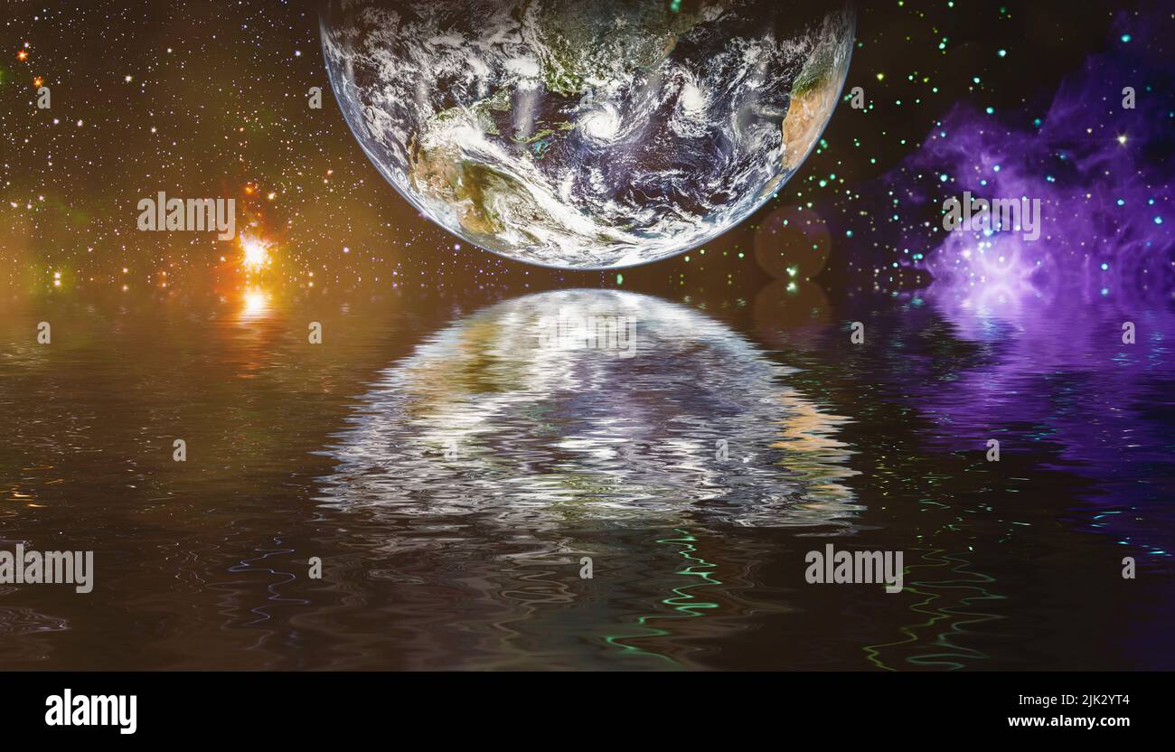 Beautiful unusual space planet in space reflected in water. galaxy ...