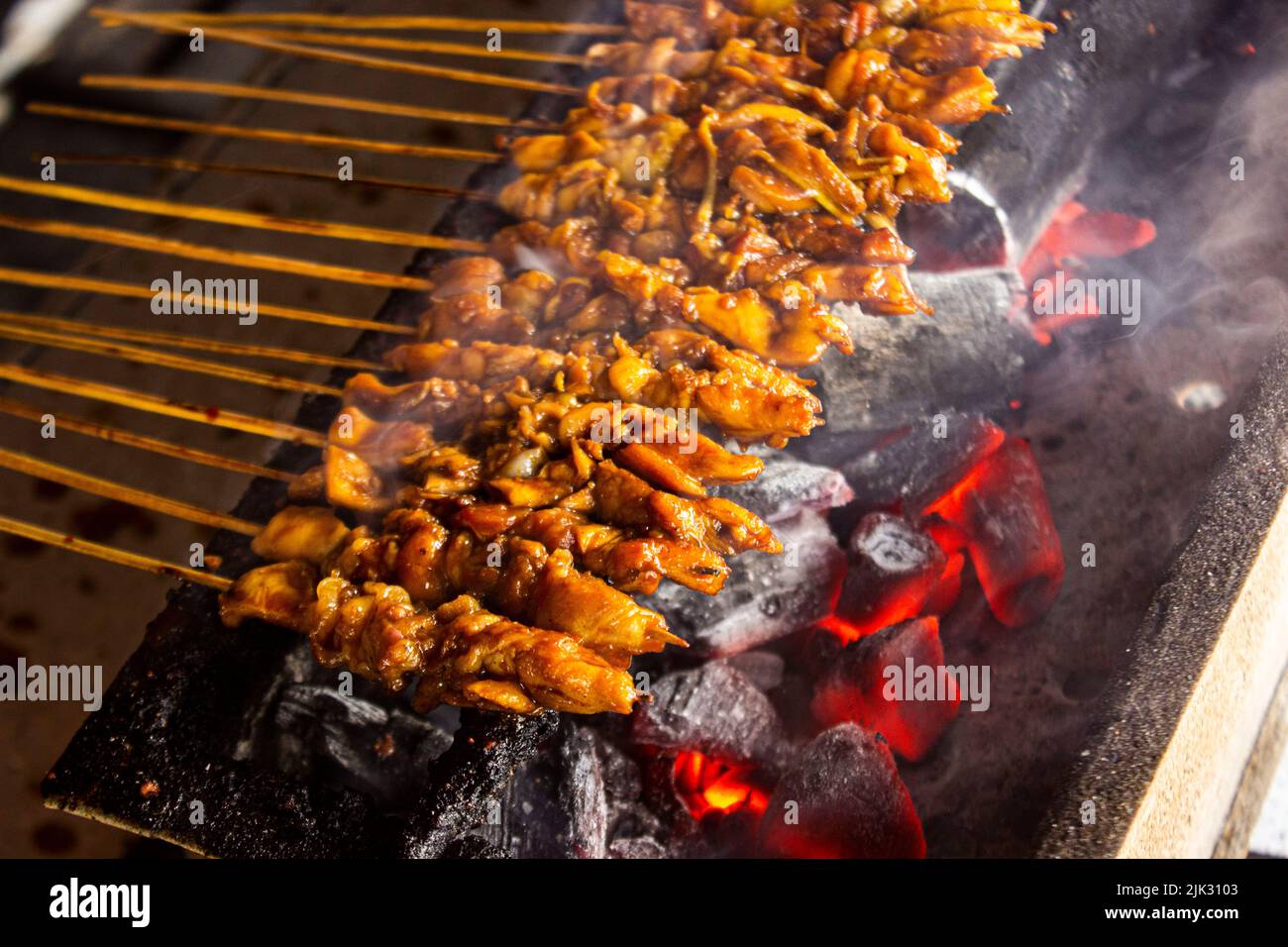 sate ayam or chicken satay , or chicken or meat satay with charcoal ...