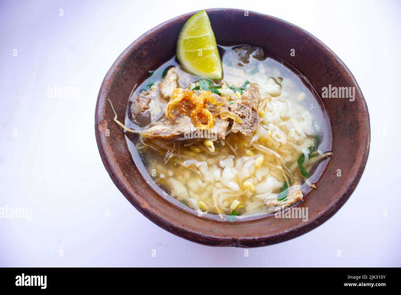 soto kwali. isolated on white background. Javanese beef clear soup with ...
