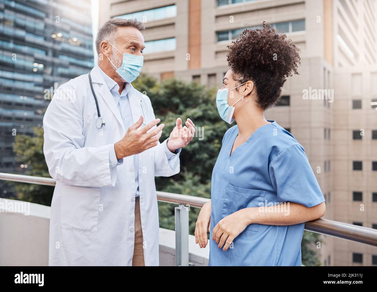 What can we do to improve in the medical field. two doctors talking in ...