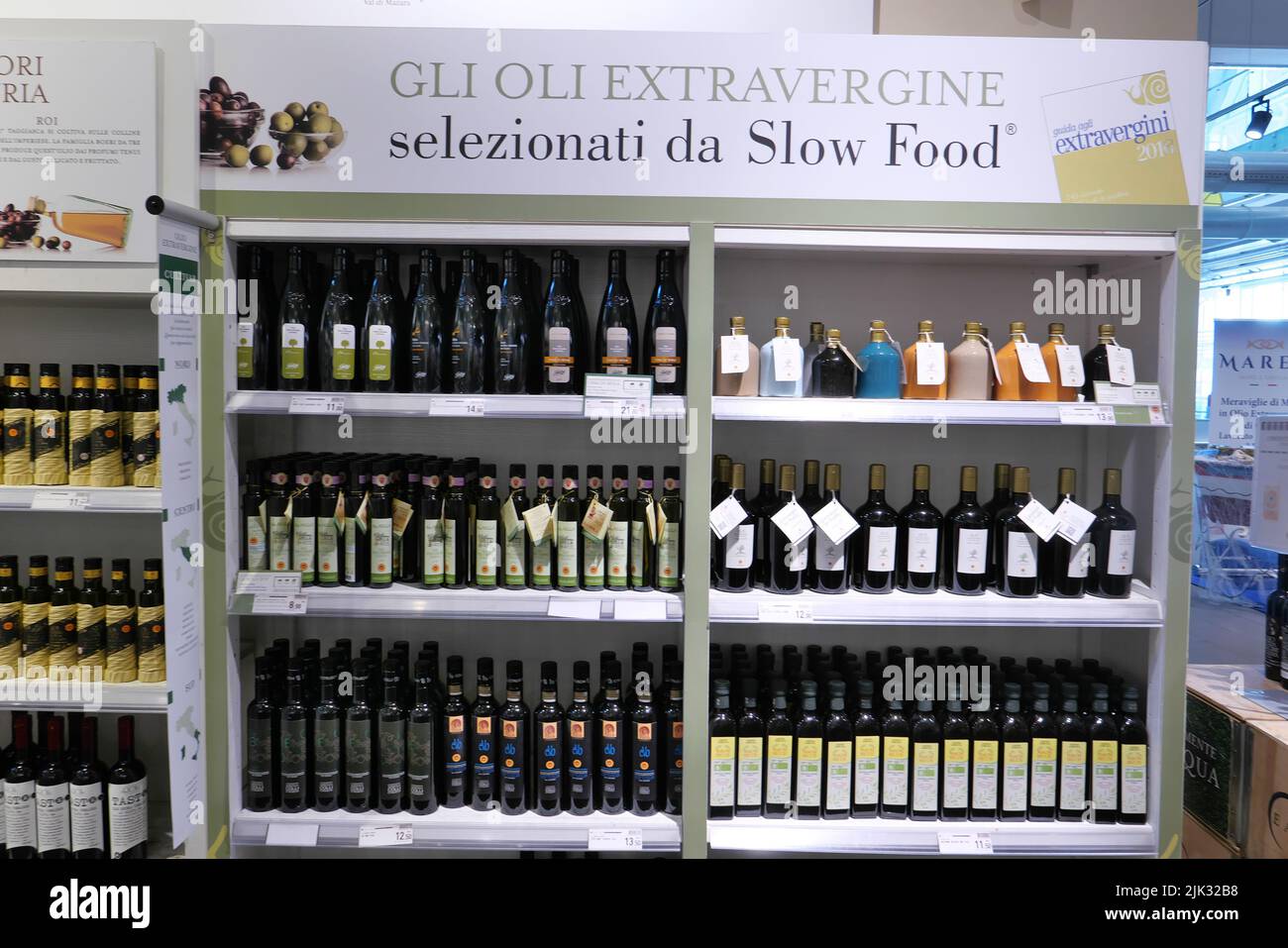 BOTTLES OF EXTRA VIRGIN OLIVE OIL ON A SHELF INSIDE THE EATALY FOOD ...