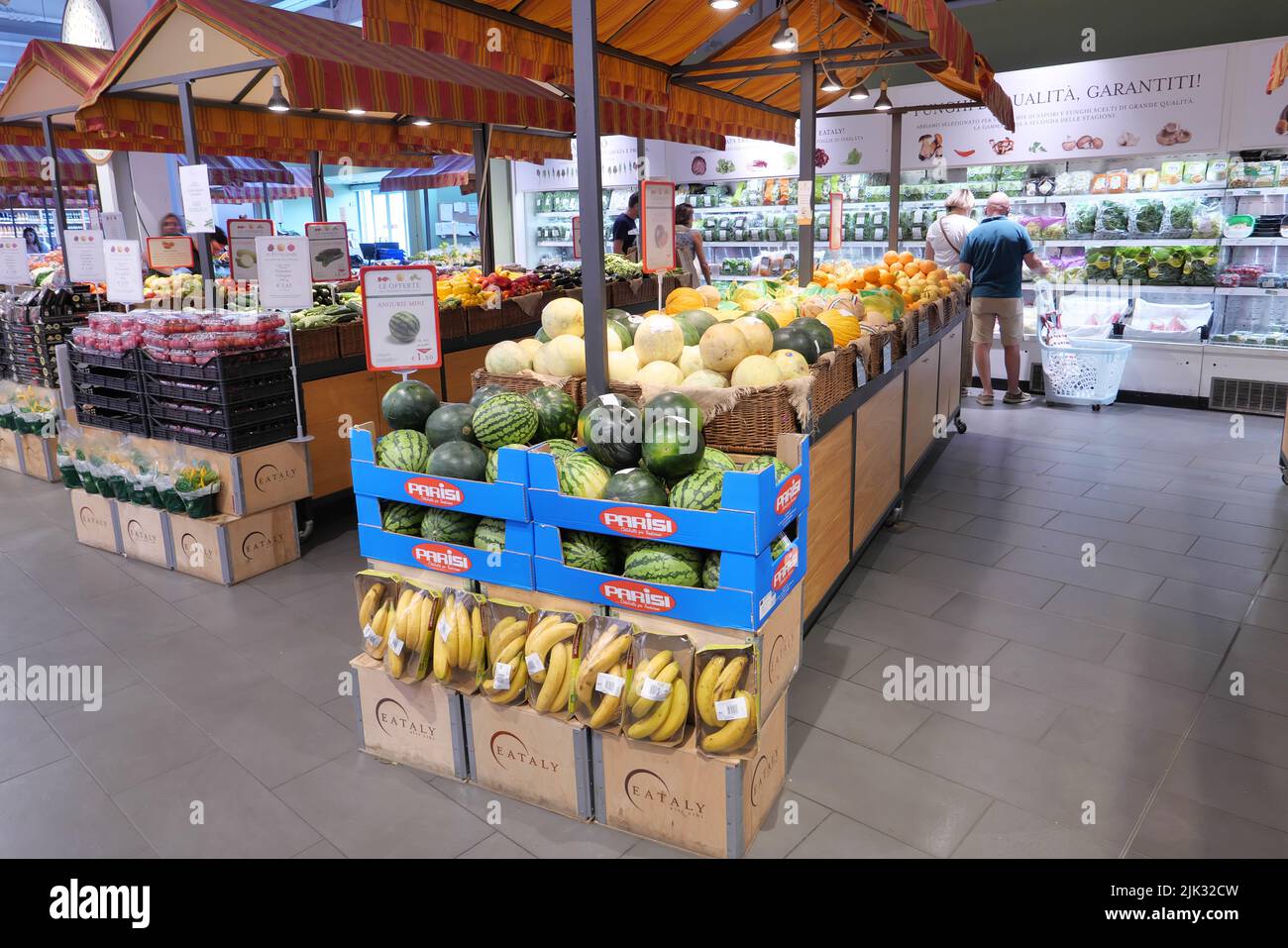 WOODEN STALLS OF FRUITS AND VEGETABLES INSIDE THE EATALY FOOD STORE ...