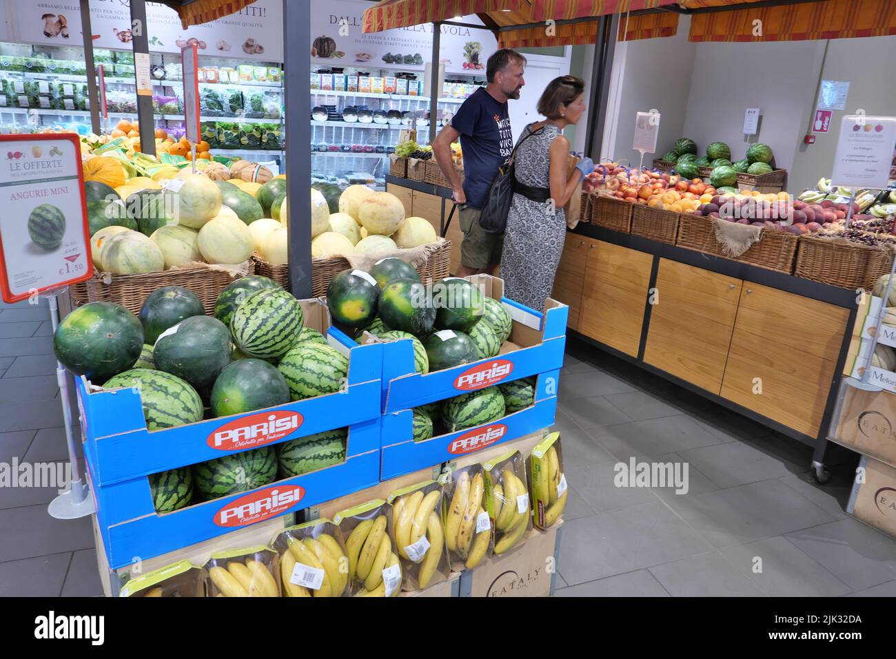 WOODEN STALLS OF FRUITS AND VEGETABLES INSIDE THE EATALY FOOD STORE ...