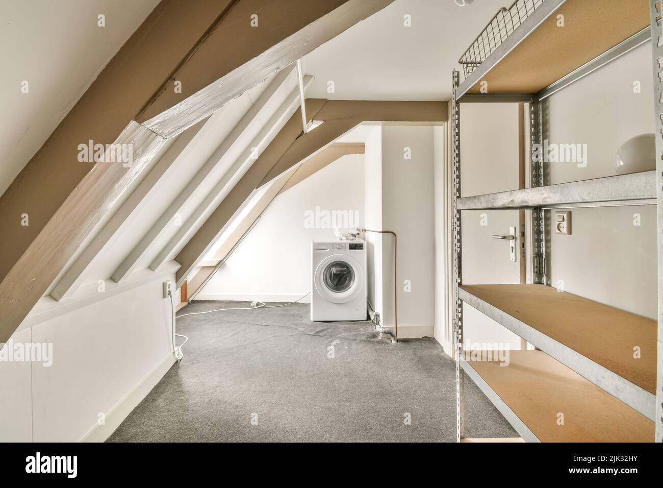 Interior of modern bright laundry room with white walls and dark ...