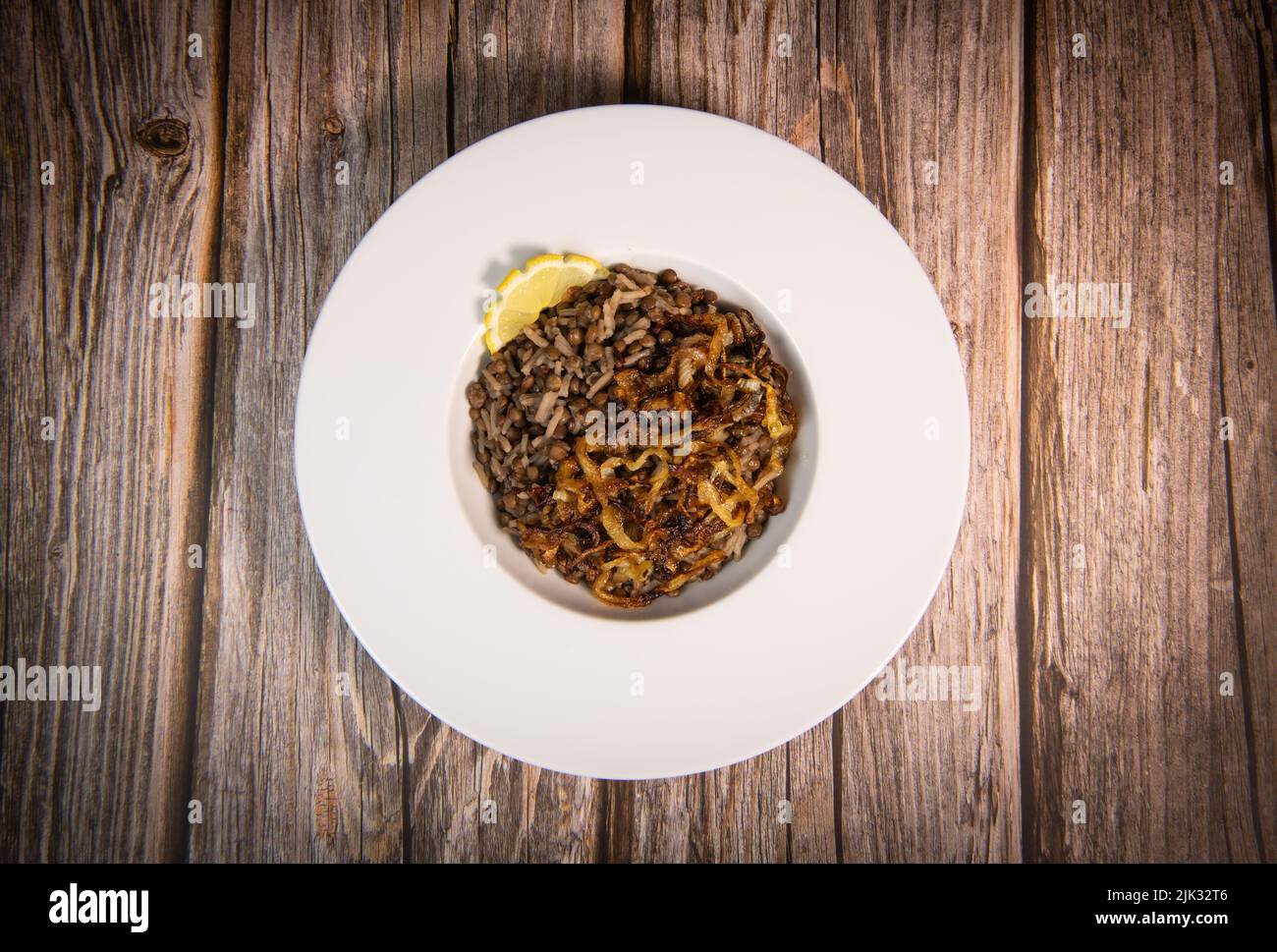 VEGAN LEBANESE LENTILS WITH GOLDEN ONIONS AND RICE RECIPE , MDARDARA B'RIZ Stock Photo - Alamy