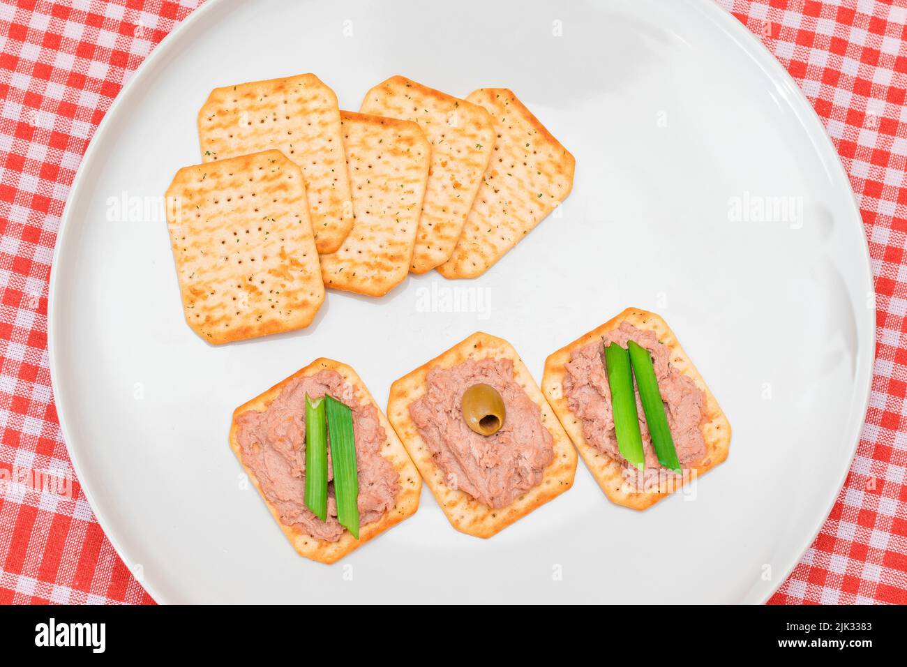 Crispy Salted Crackers with Liver Pate, Green Onions and Olives on ...