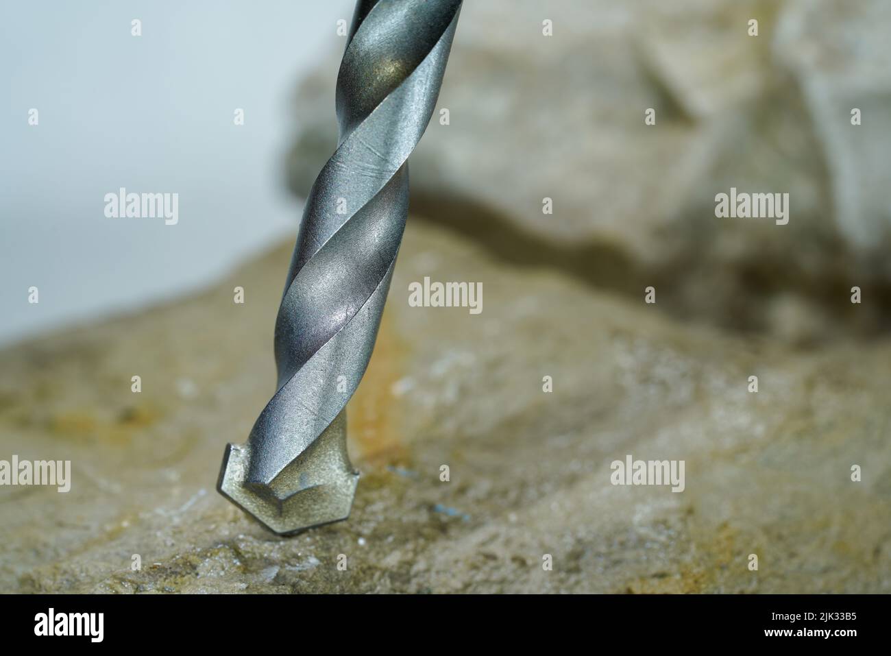 Stone drill with point for drilling in natural stone and concrete ...