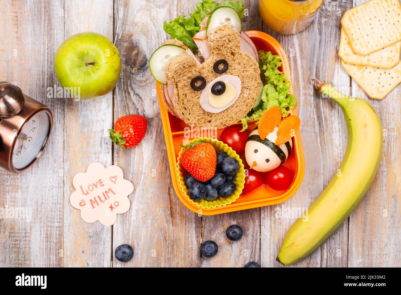 Kids lunch box with funny bear sandwich and boiled egg bee, banana ...