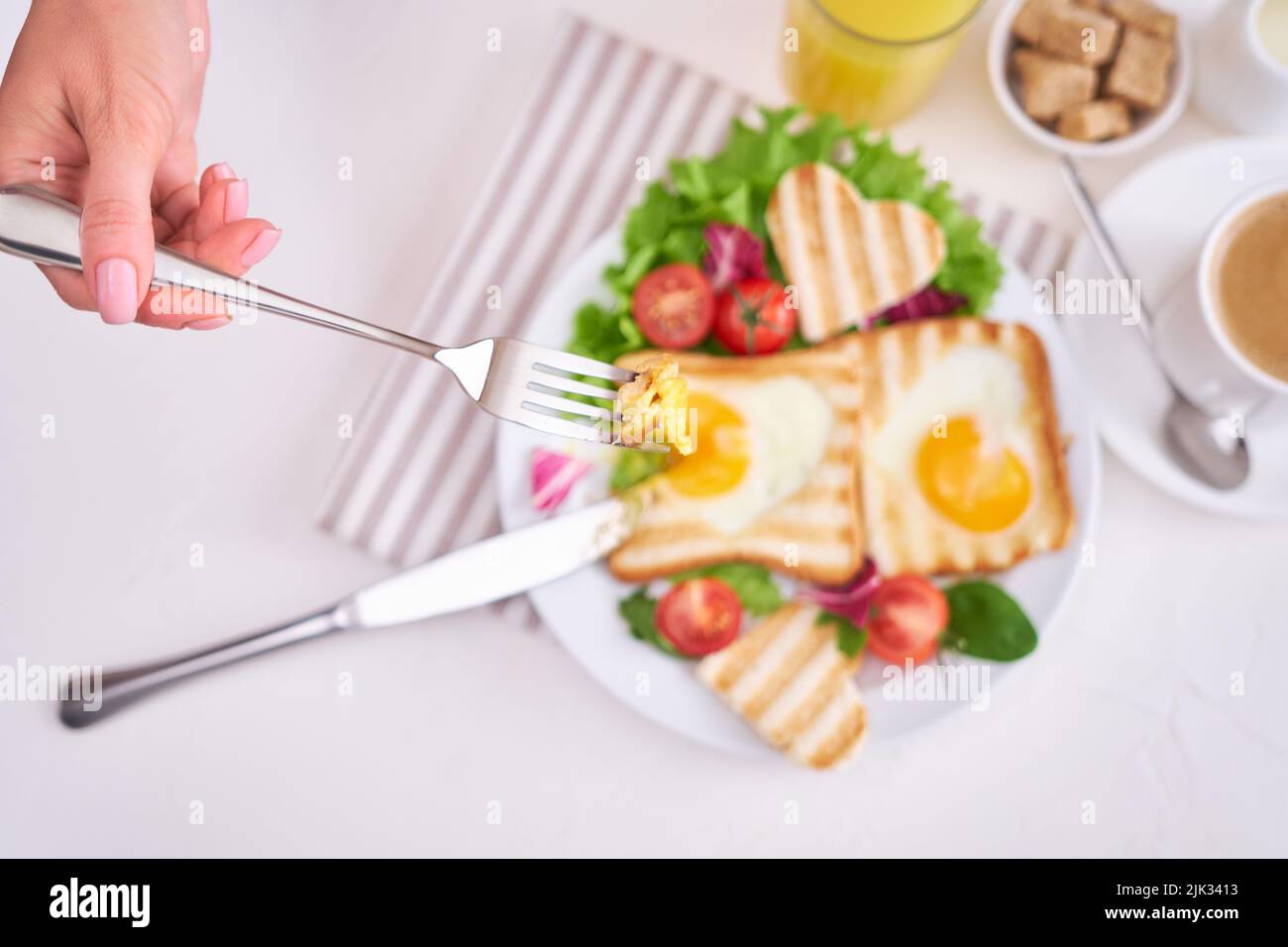 Heart Shaped Fried Egg on Toast Bread on light grey background Stock Photo - Alamy