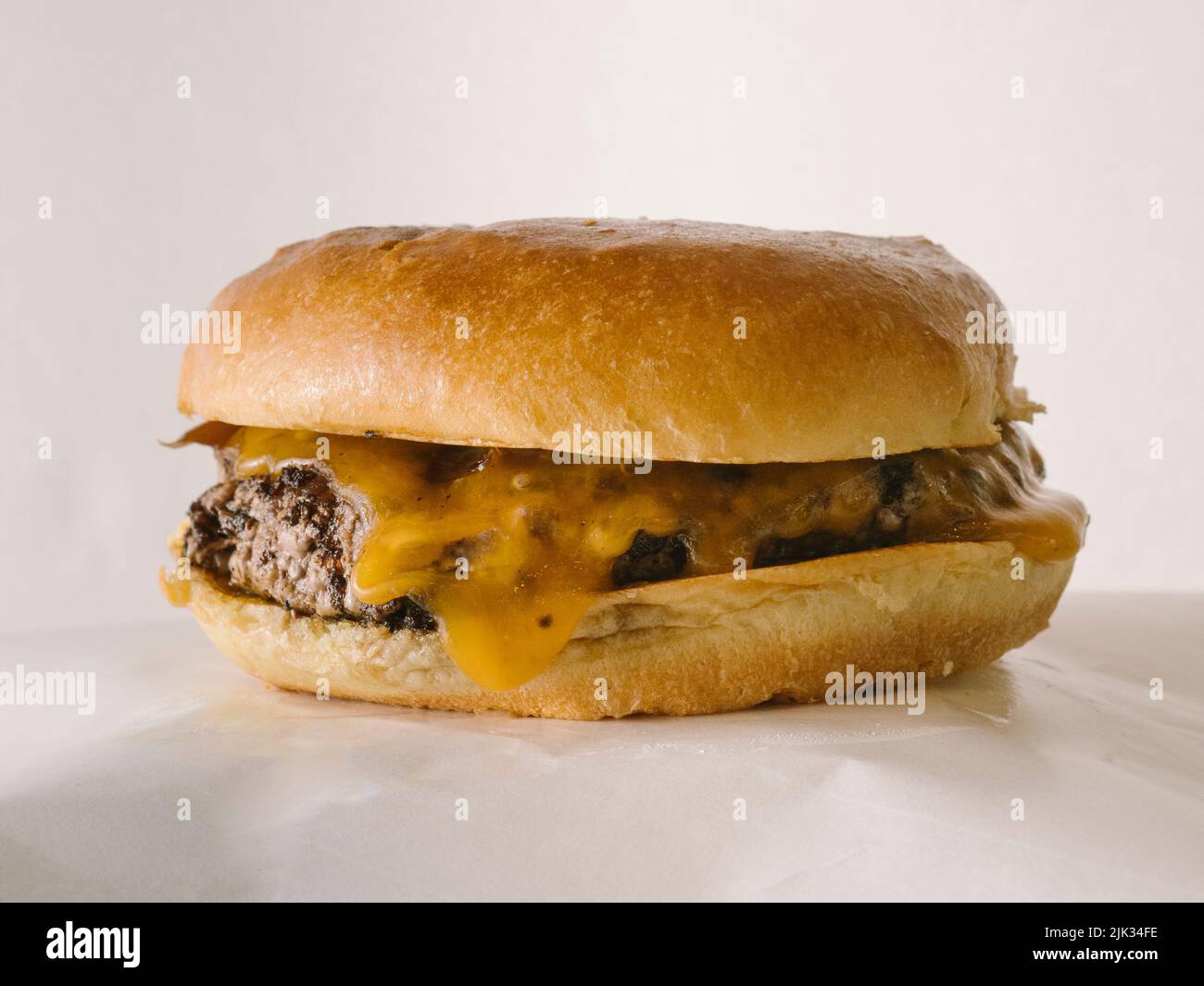 Close up view of Single cheese burger with caramalised onions Stock ...