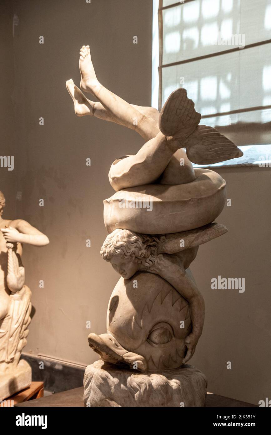 NAPLES, ITALY - MAY 06, 2022 - Ancient Roman sculpture of a young man ...