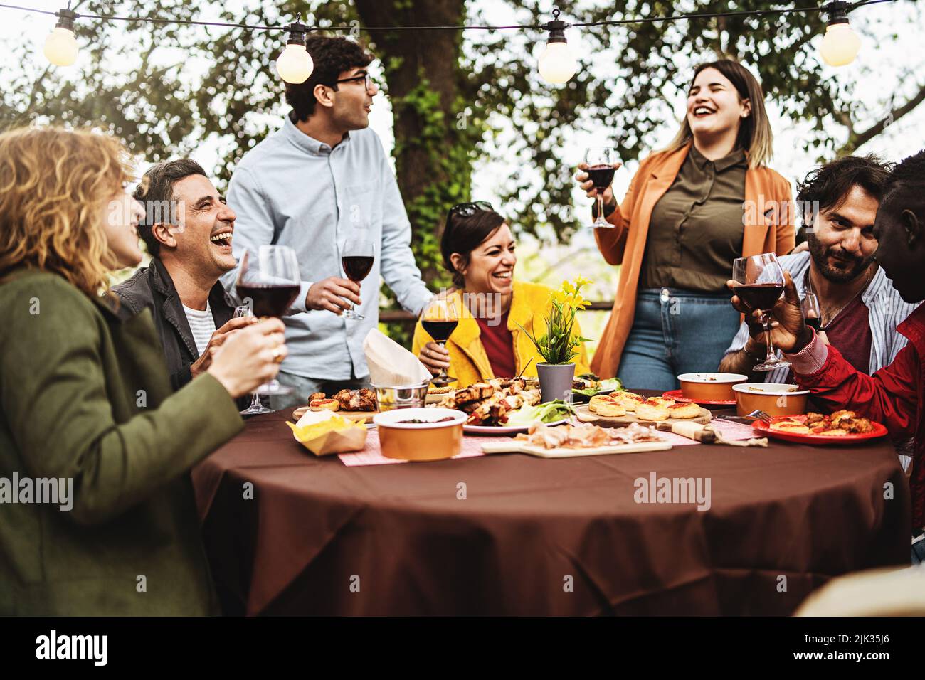 Adults sitting at picnic table hi-res stock photography and images - Alamy