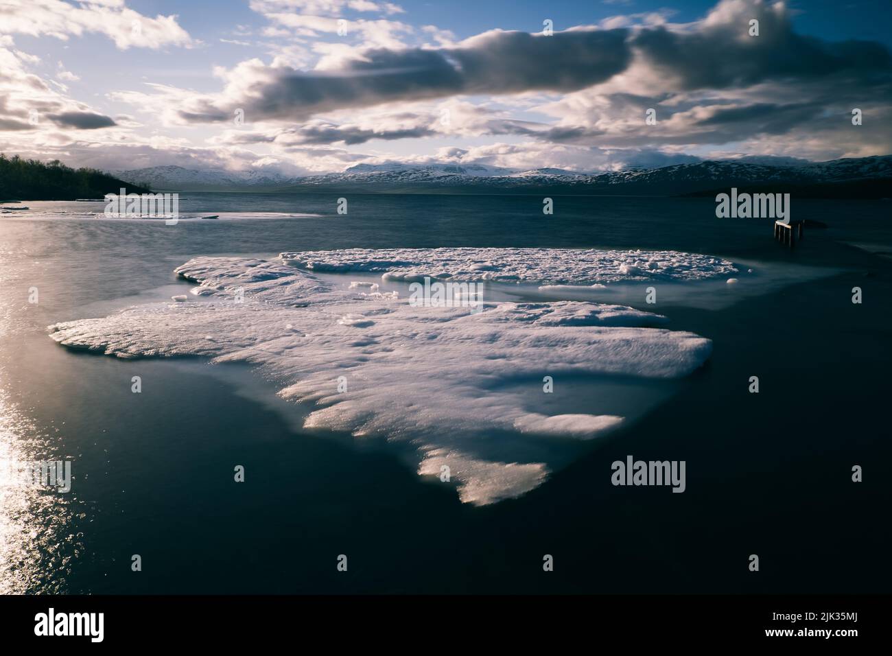 Iceberg floating on an arctic lake Stock Photo - Alamy