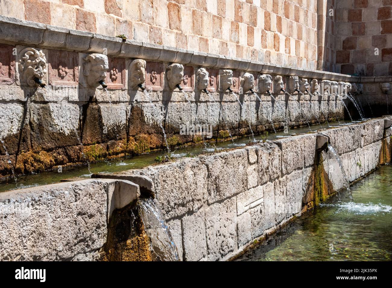 Famous mediaeval Fountain of 99 Spouts in ithe old town of L'Aquila ...