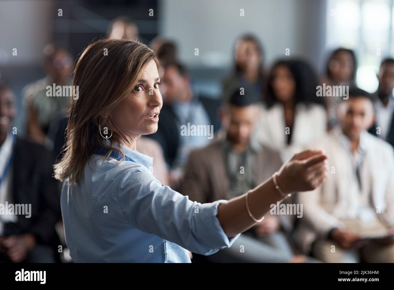 I think I made it. a businesswoman delivering a presentation at a ...